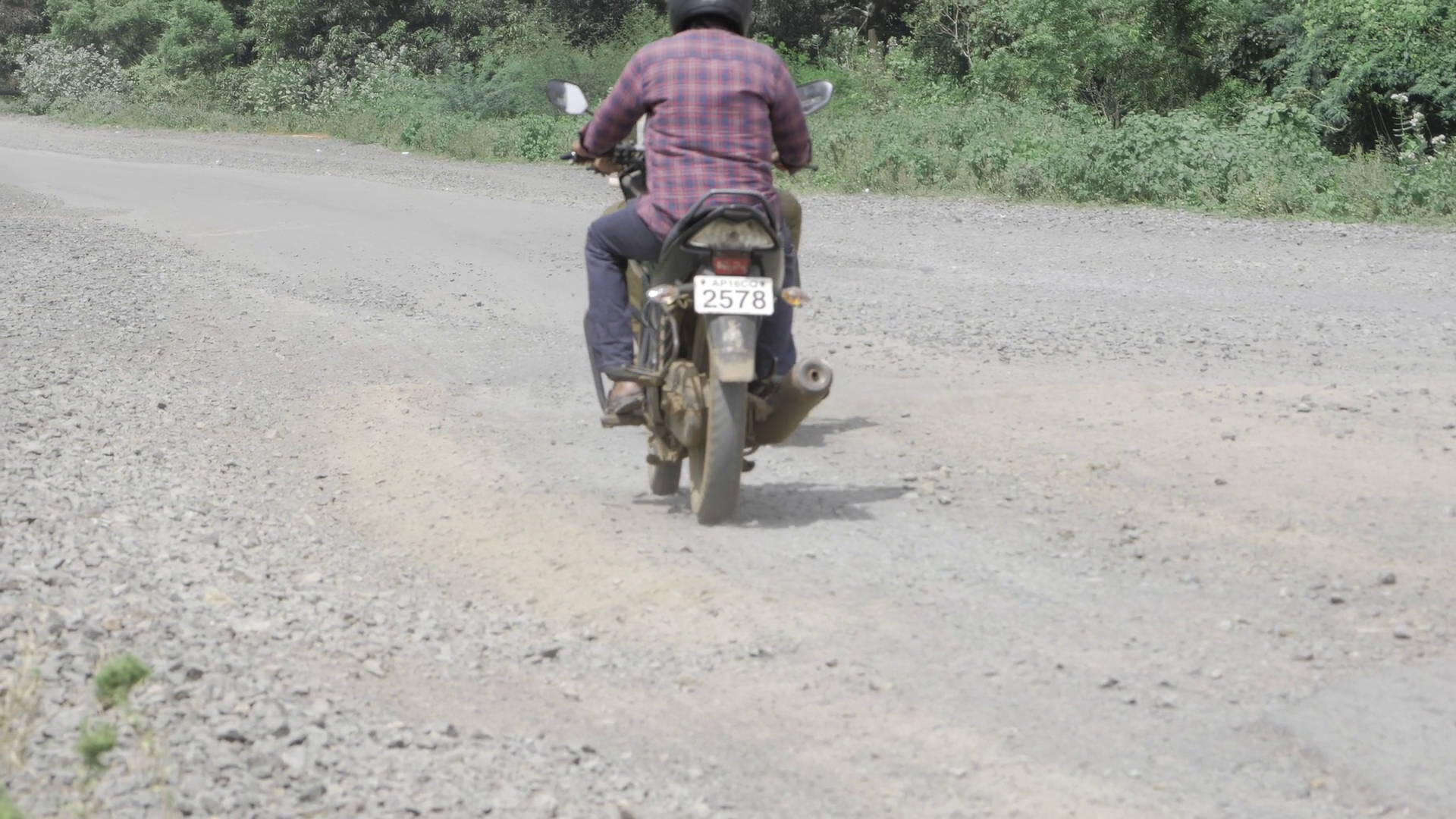 Motorcycle Riding Through Rock-riddled Road Stock Footage SBV-352762224 ...