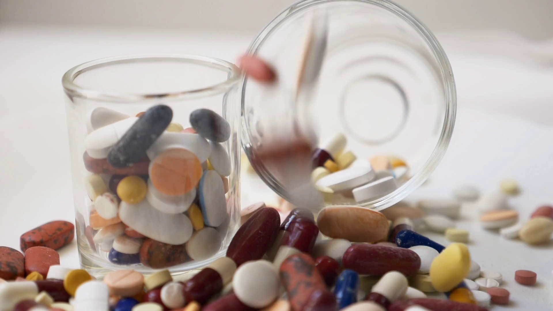 Different Pills Capsules Falling Into Table Stock Footage SBV-338734581 ...