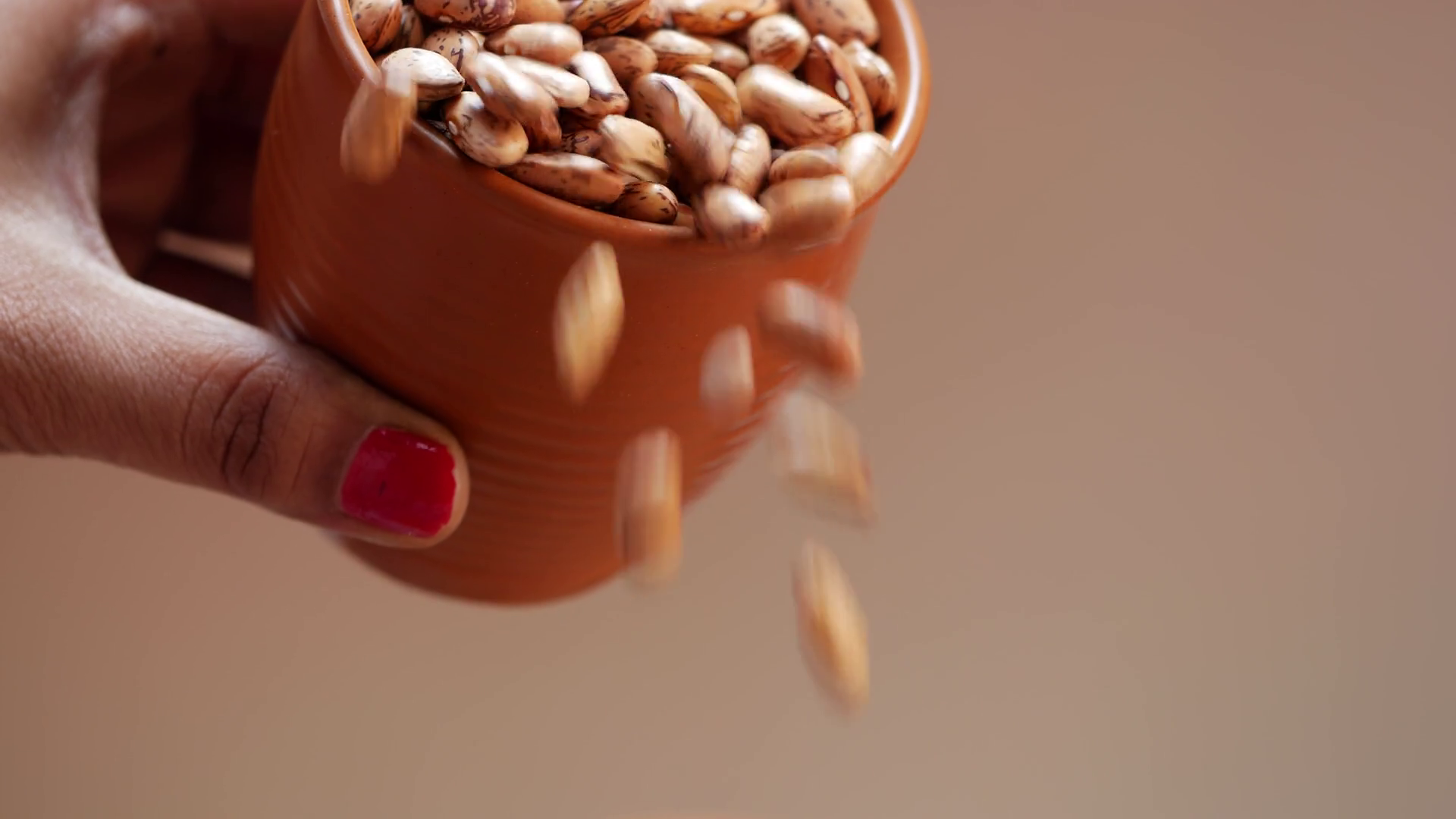 A Hand Pouring Peanuts Into Cup Bowl Of Stock Footage SBV-348418749 ...