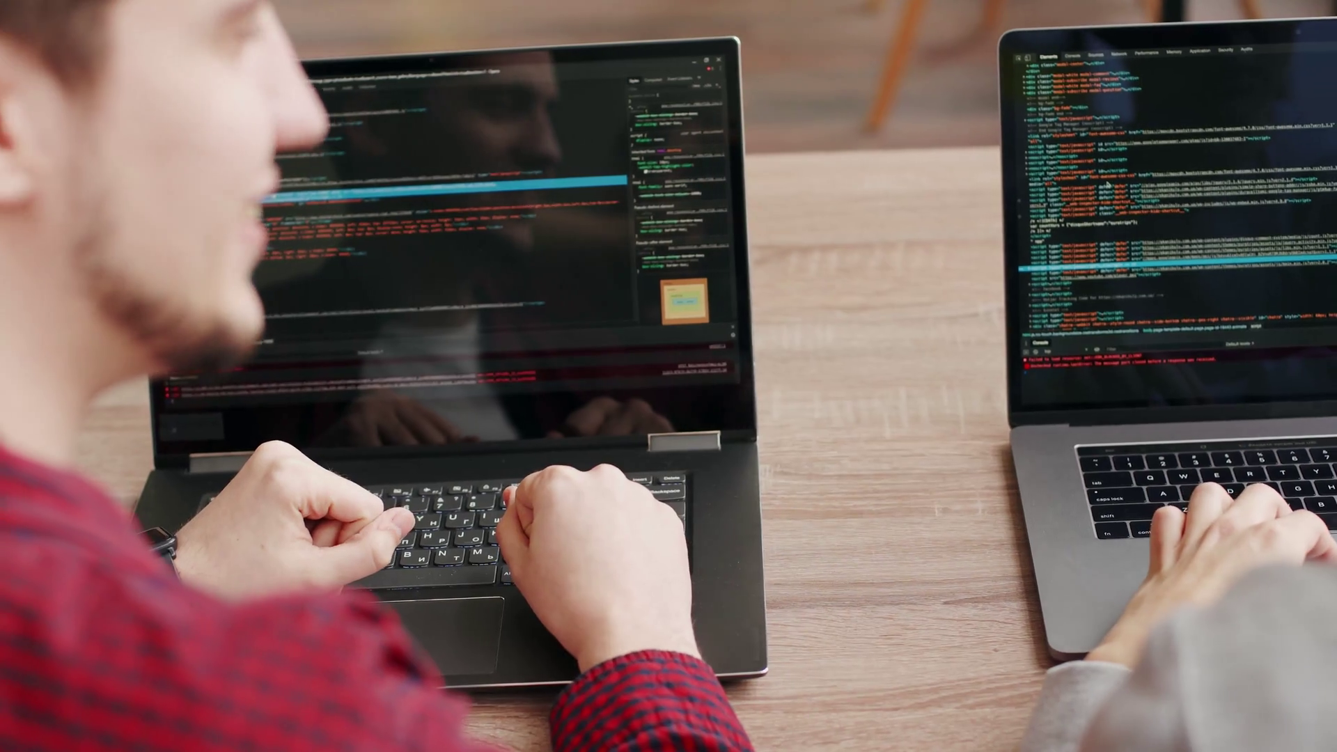 Two hipster coworkers sharing ideas about project sitting with laptops ...