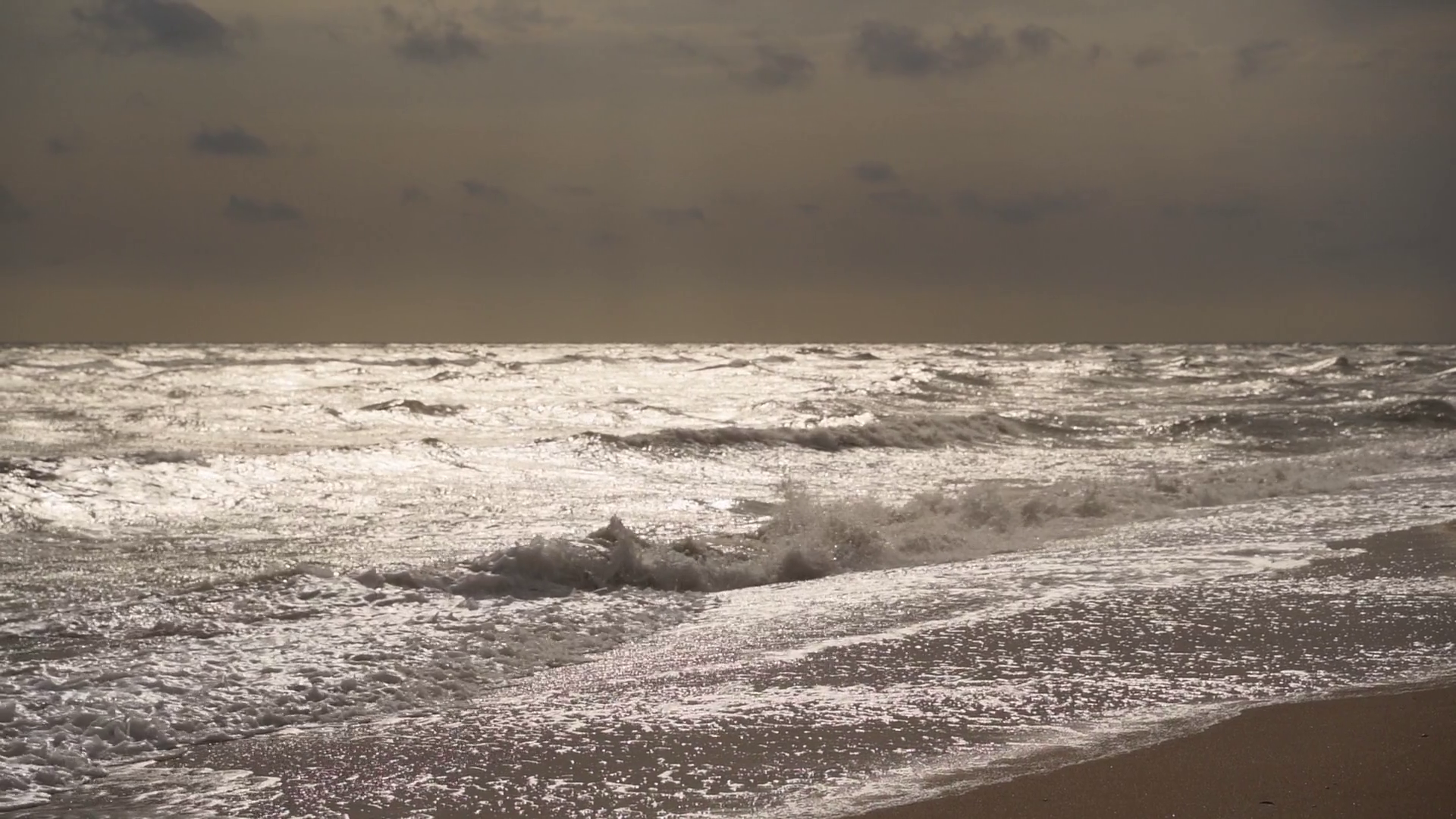 Choppy Waves Crash On Sandy Beach Under Stock Footage SBV-348733094 ...