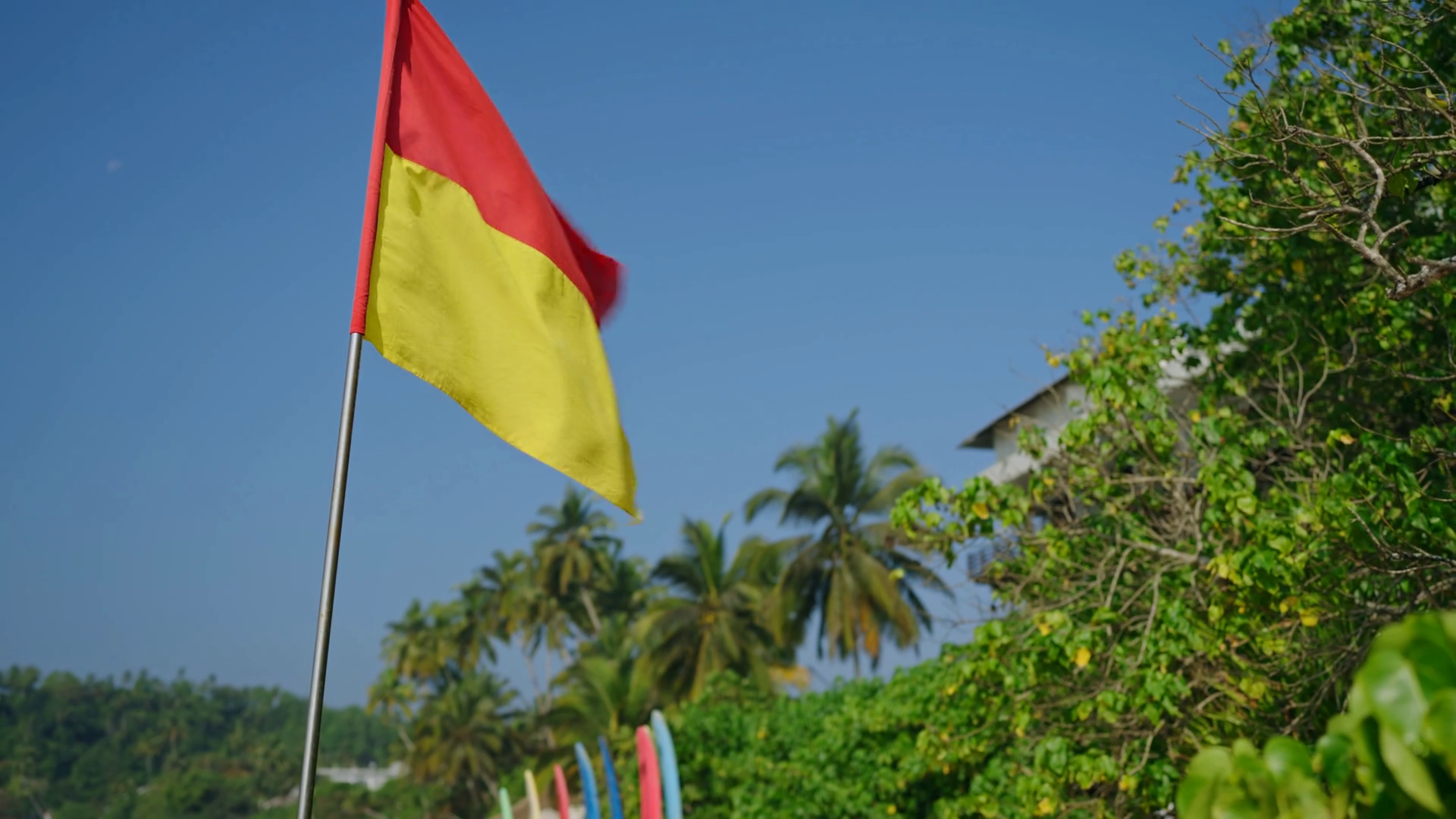 Red Over Yellow Beach Flag Flutters In Stock Footage SBV-348803345 ...