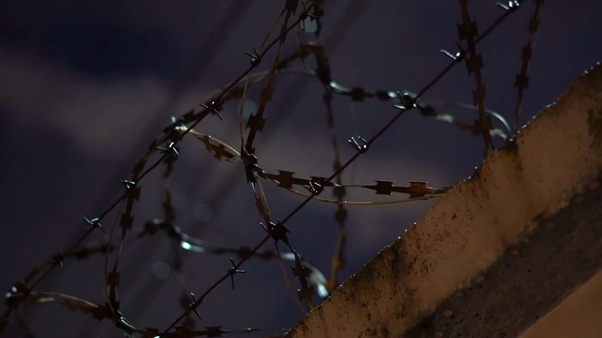 Barbed Wire Fence Details Against Of Night Stock Footage SBV-348529039 ...