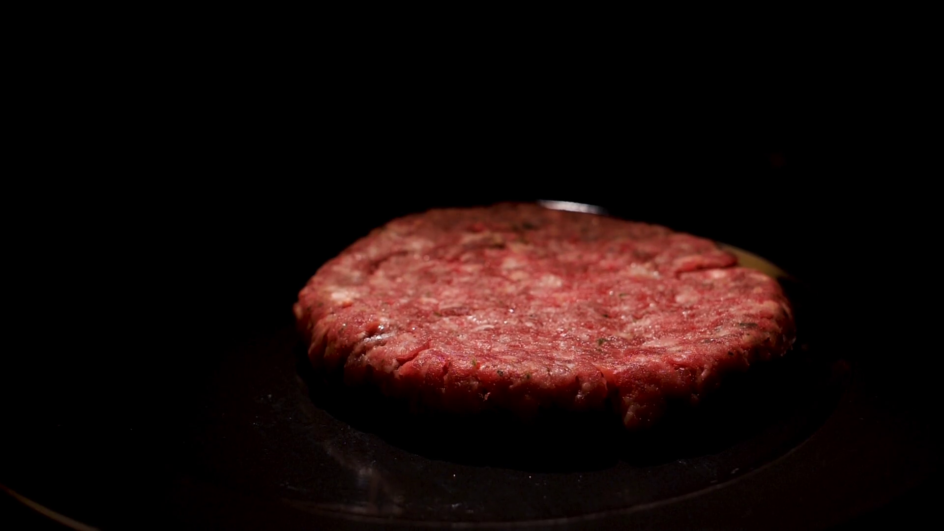 Close Up Of Raw Burger Beef Patty On Black Stock Footage SBV-348530520 ...