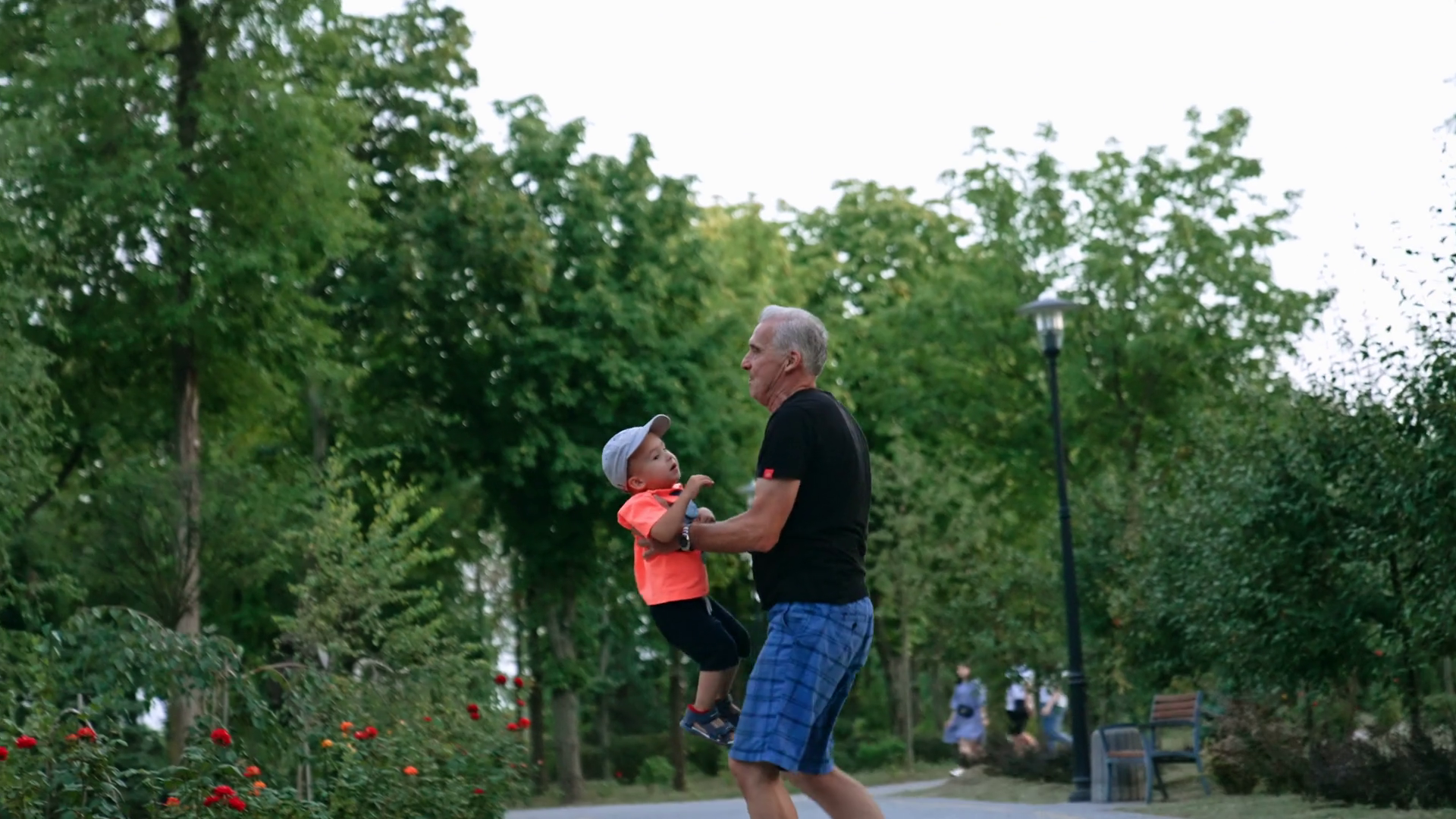 Kid In Cap Runs Up To Grandpa Man Tosses Stock Footage SBV-352957658 ...