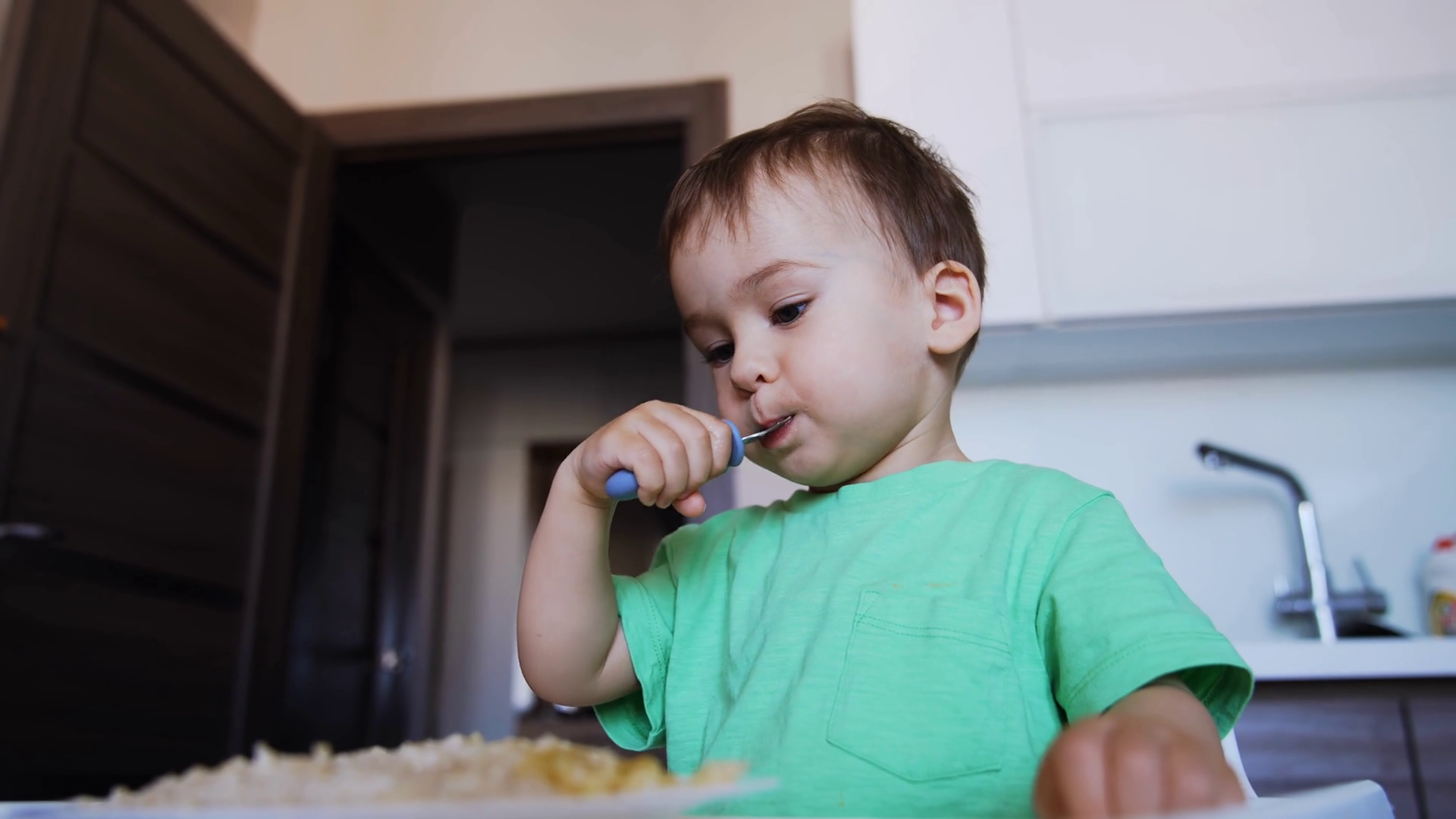 Lovely Toddler Eating From Form Mom Helps To Stock Footage SBV ...