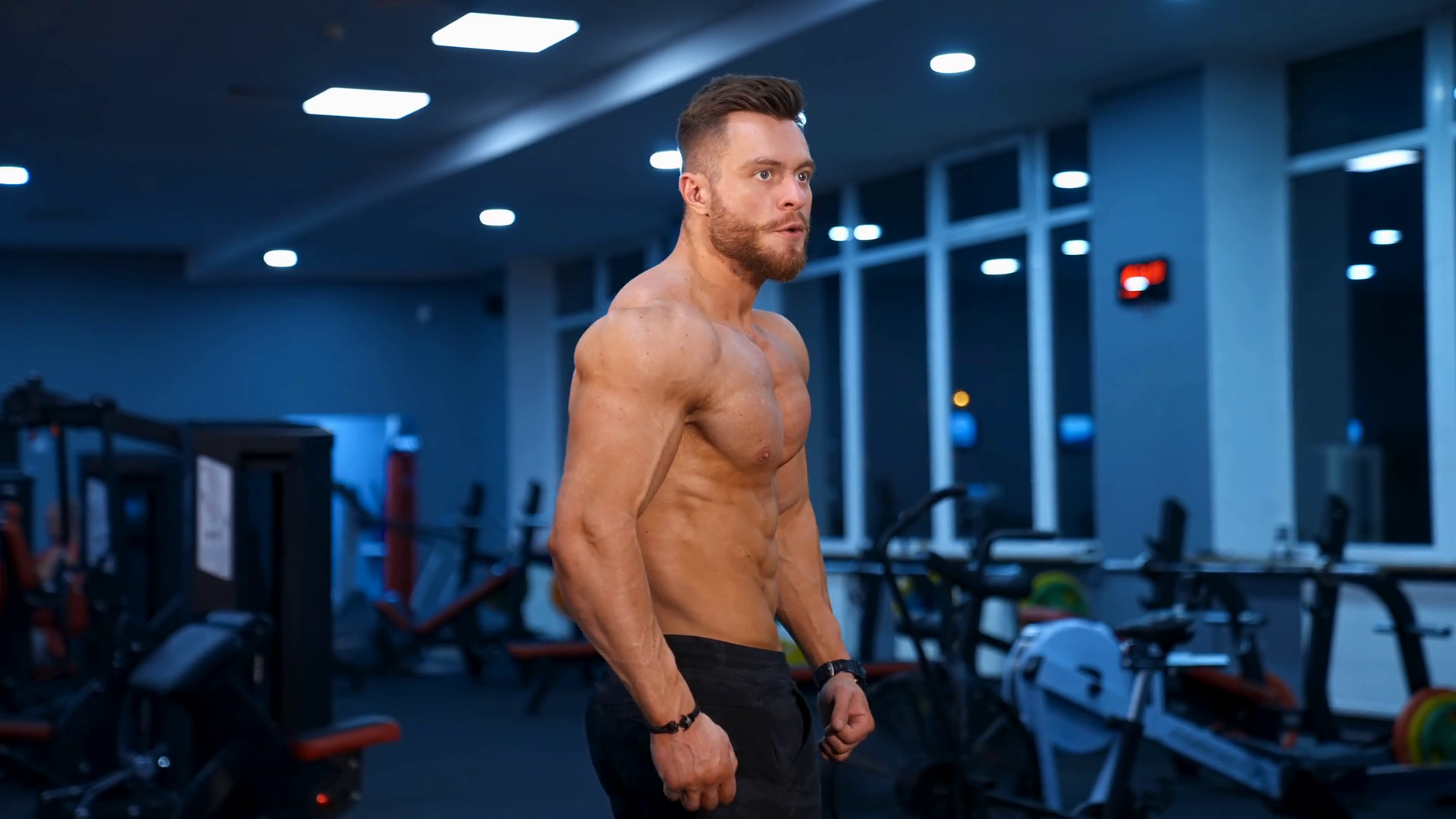 Model Bodybuilder Poses To Camera Shows Stock Footage SBV-353245582 ...