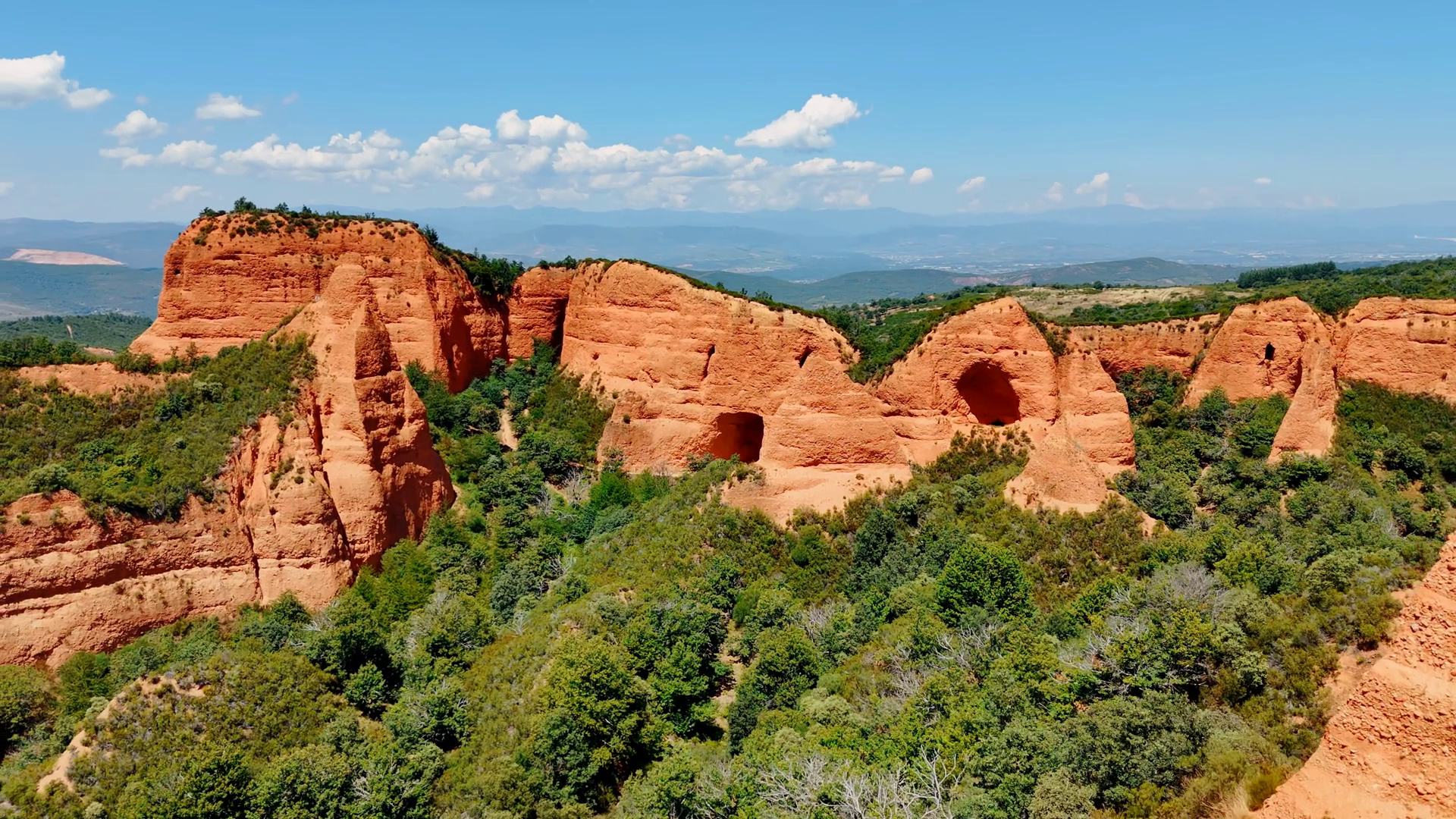 Orange Rock Formations With Caves In Lush Stock Footage SBV-352989802 ...