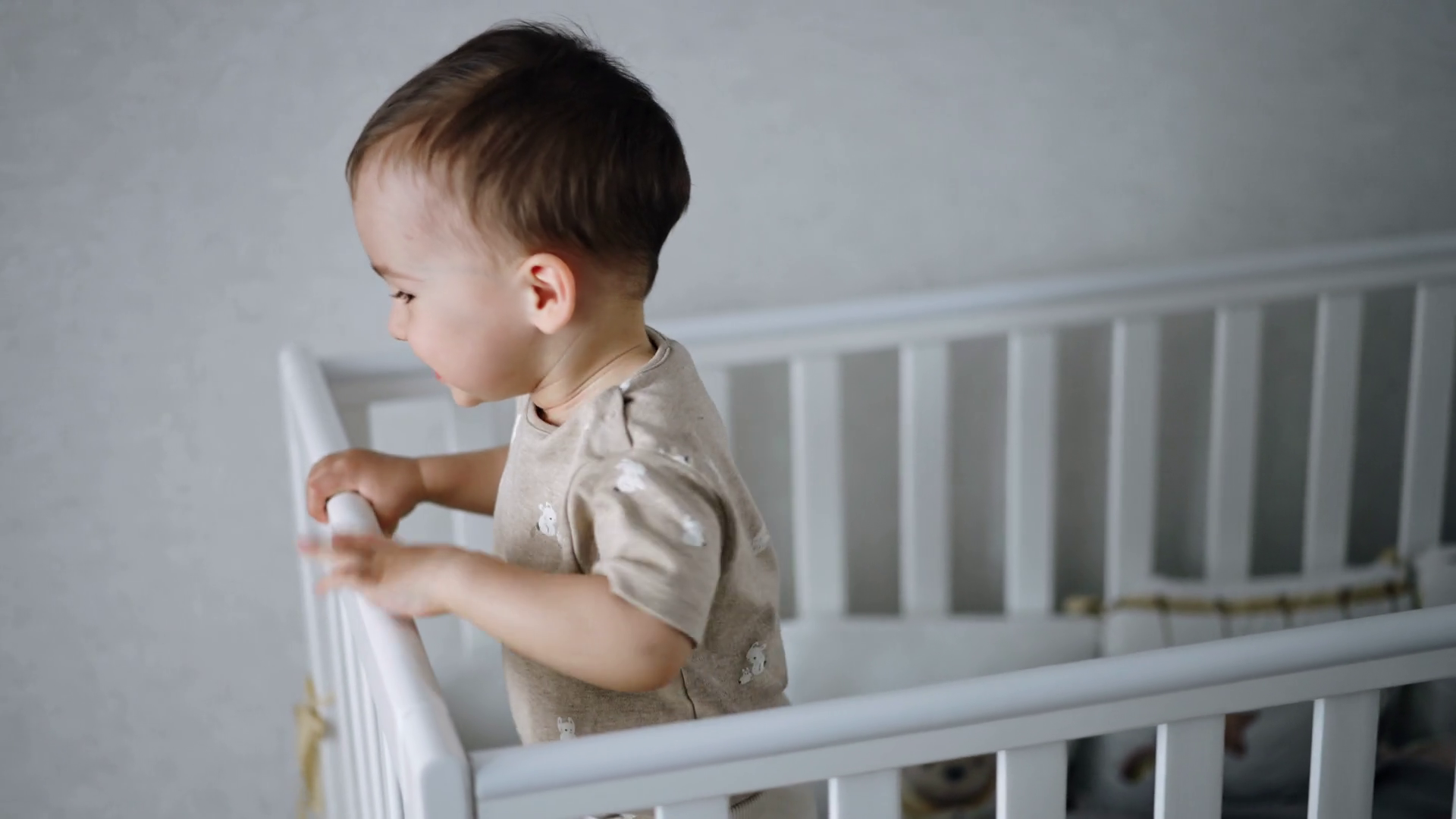 Smiling Caucasian Kid Stands In White Crib Stock Footage SBV-353000156 ...