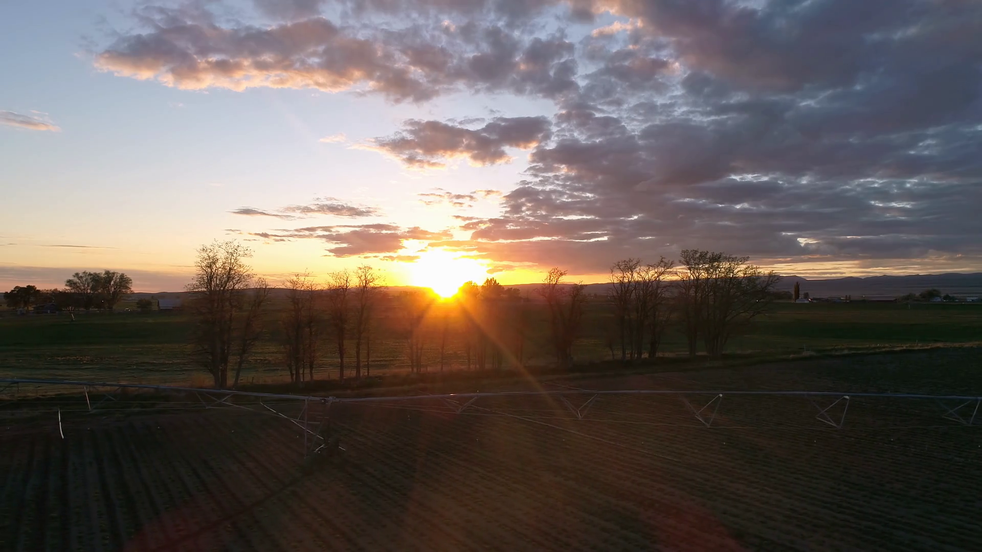 Panning View Of Sunset Over Farm Field Sun Stock Footage SBV-348570455 ...
