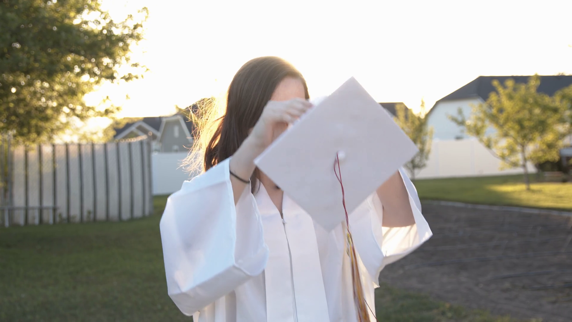 High School Teenager Putting On Cap With Stock Footage SBV-348570548 ...