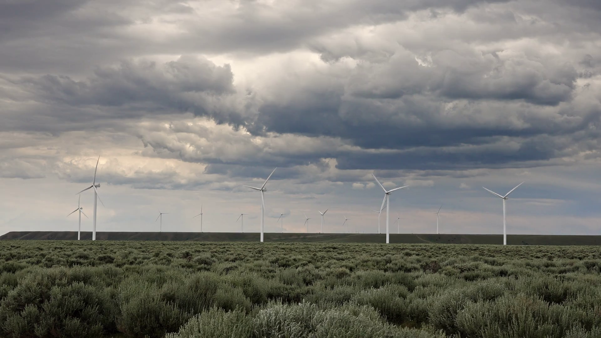 Windmills In Wyoming Spinning With Dramatic Stock Footage SBV-348412976 ...