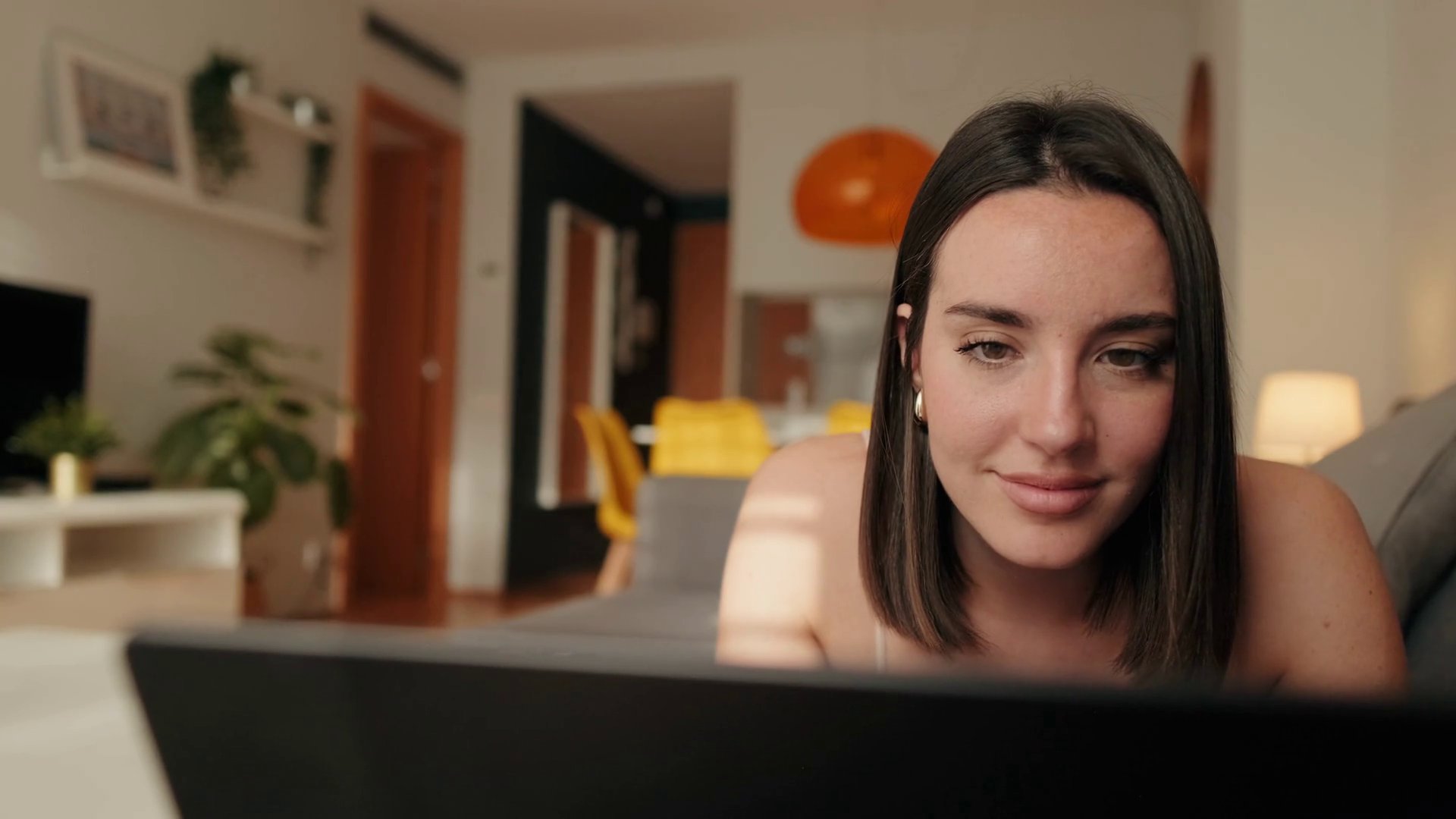 Pretty Woman Browsing On Laptop At Home On Stock Footage SBV-352179197 - Storyblocks
