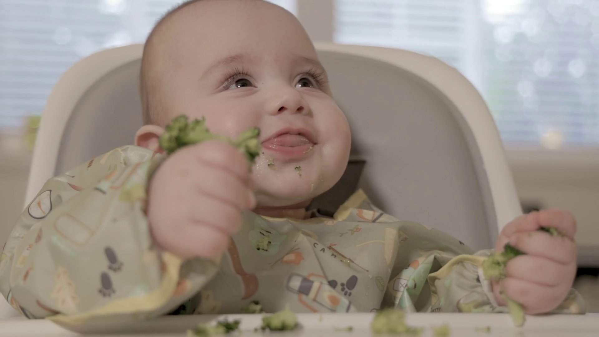 Sweet Baby Boy In High Chair Eating Broccoli Stock Footage SBV ...