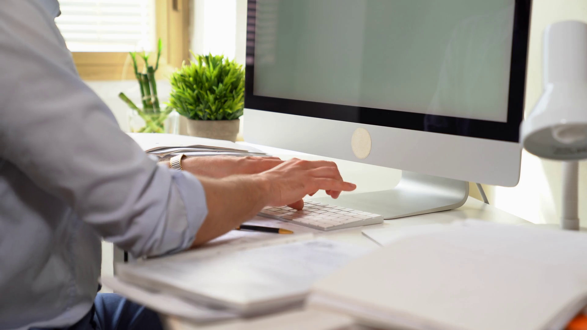 Manager working on a desktop computer in office. Paperwork Stock Video ...