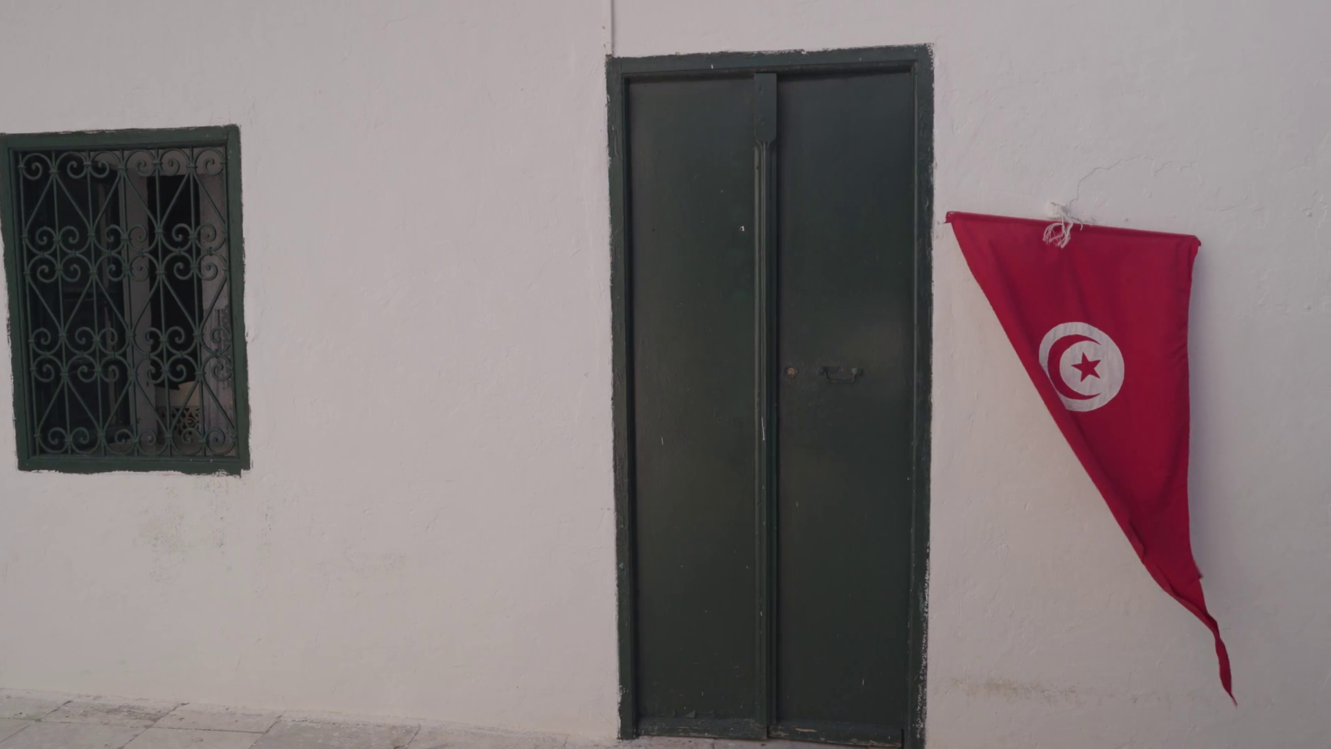 Tunisian Flag On White Wall In Sidi Bou Said Stock Footage SBV ...