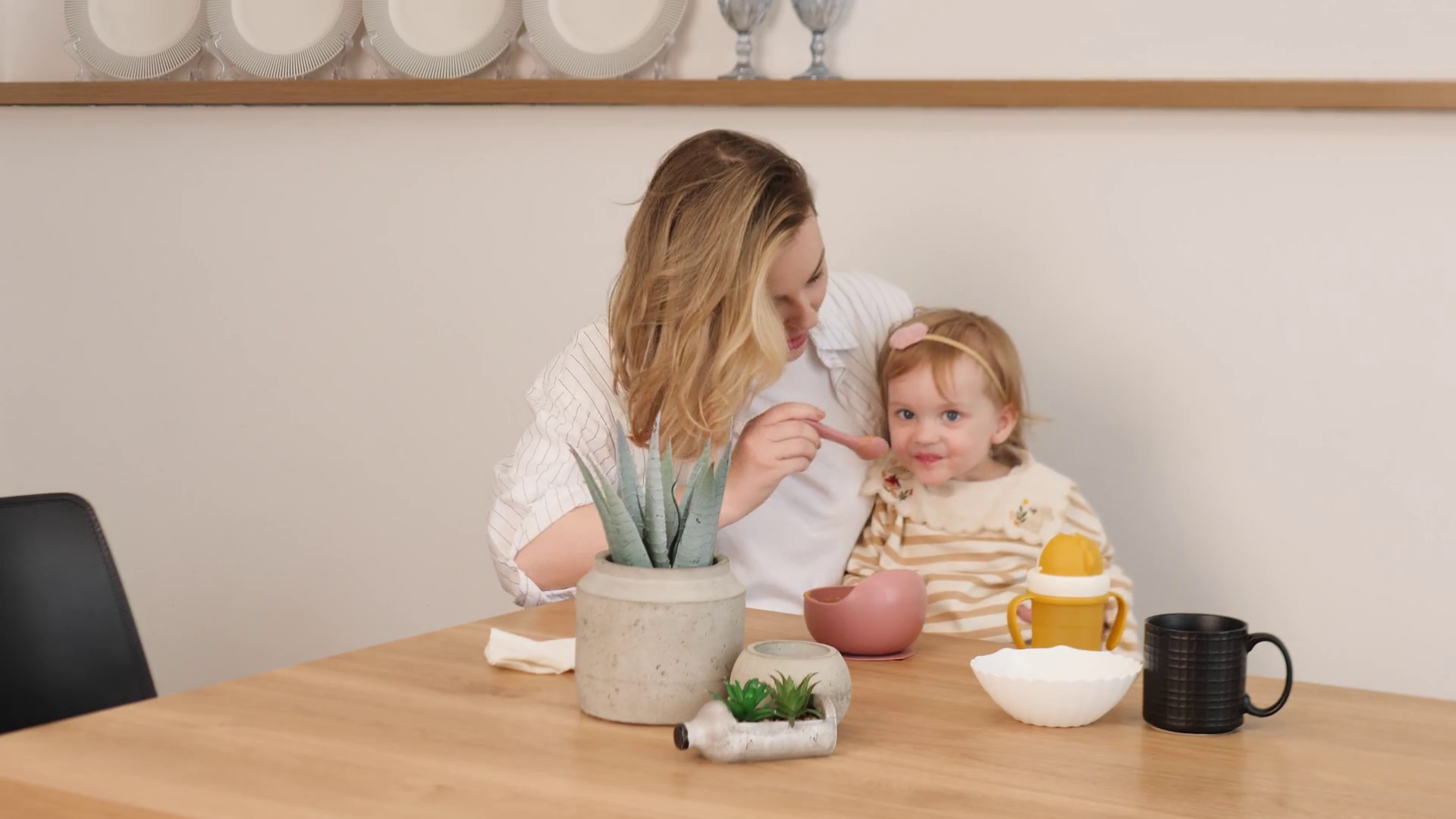 A Mother Joyfully Feeding Daughter At Stock Footage SBV-352251438 ...