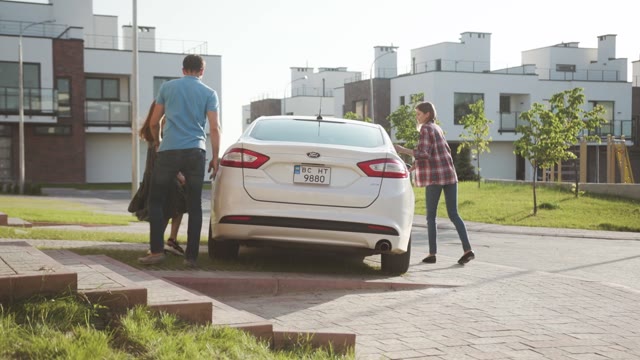 Family Getting Out Of Car Stock Footage: Royalty-Free Video Clips ...