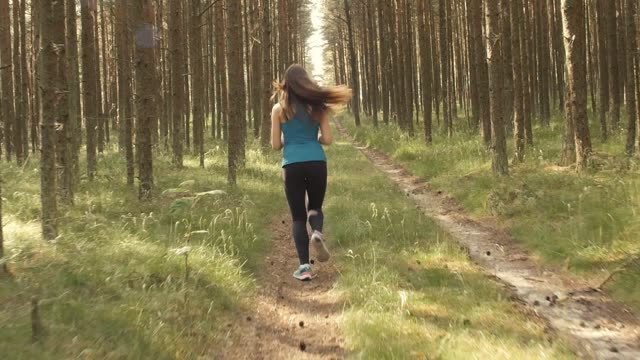 Girl Running Through The Woods Stock Footage: Royalty-Free Video Clips ...
