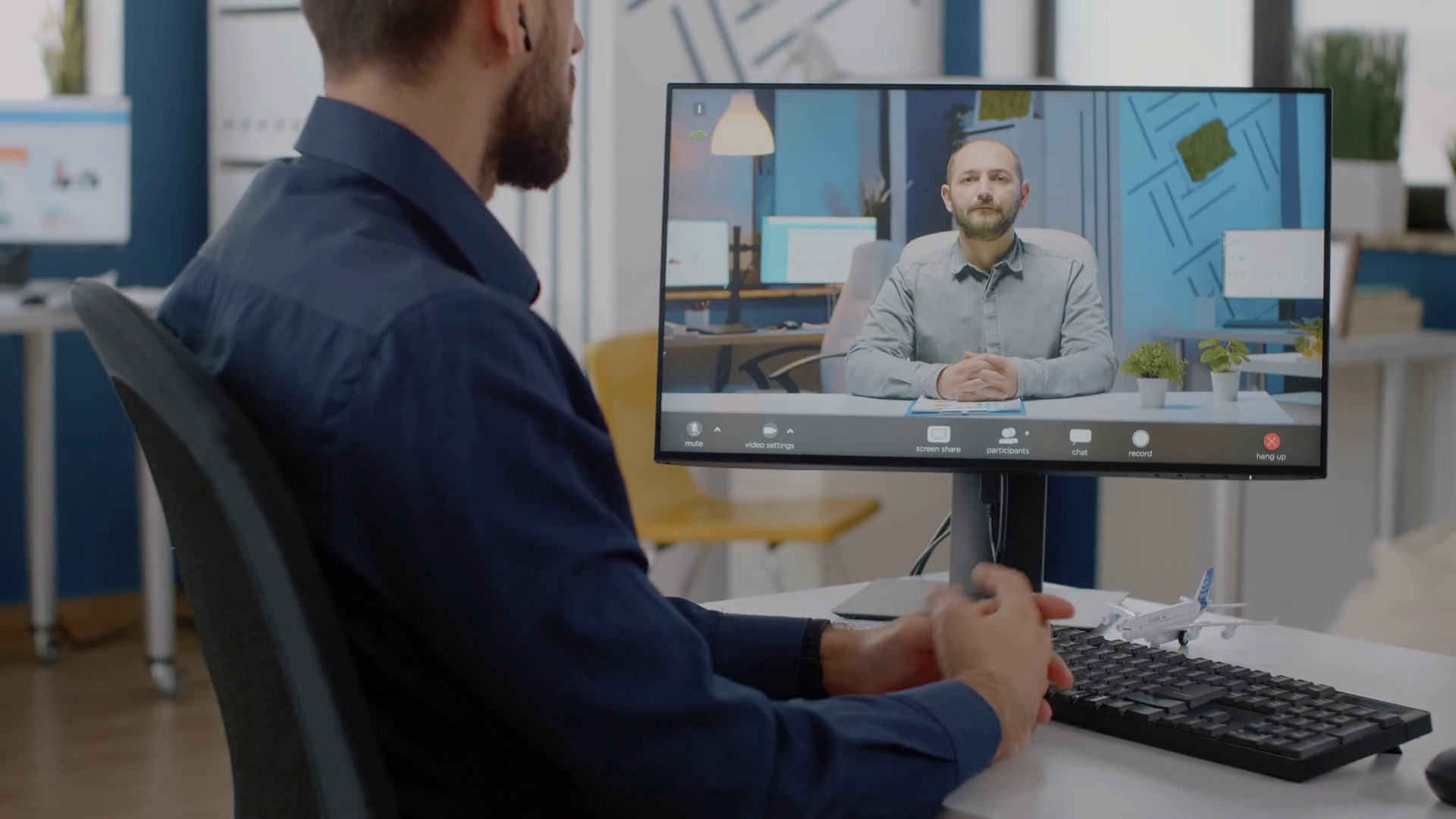 Entrepreneur using video call on computer for discussion with manager ...