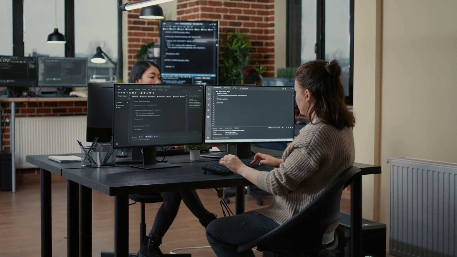 Junior developer putting laptop with source code on senior dev desk ... Junior developer putting laptop with source code on senior dev desk ...