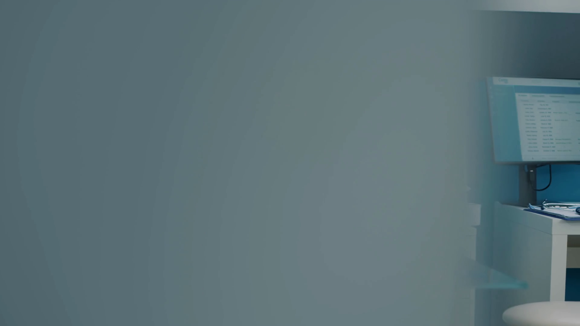 Empty desk in doctors office with computer and medical instruments ...