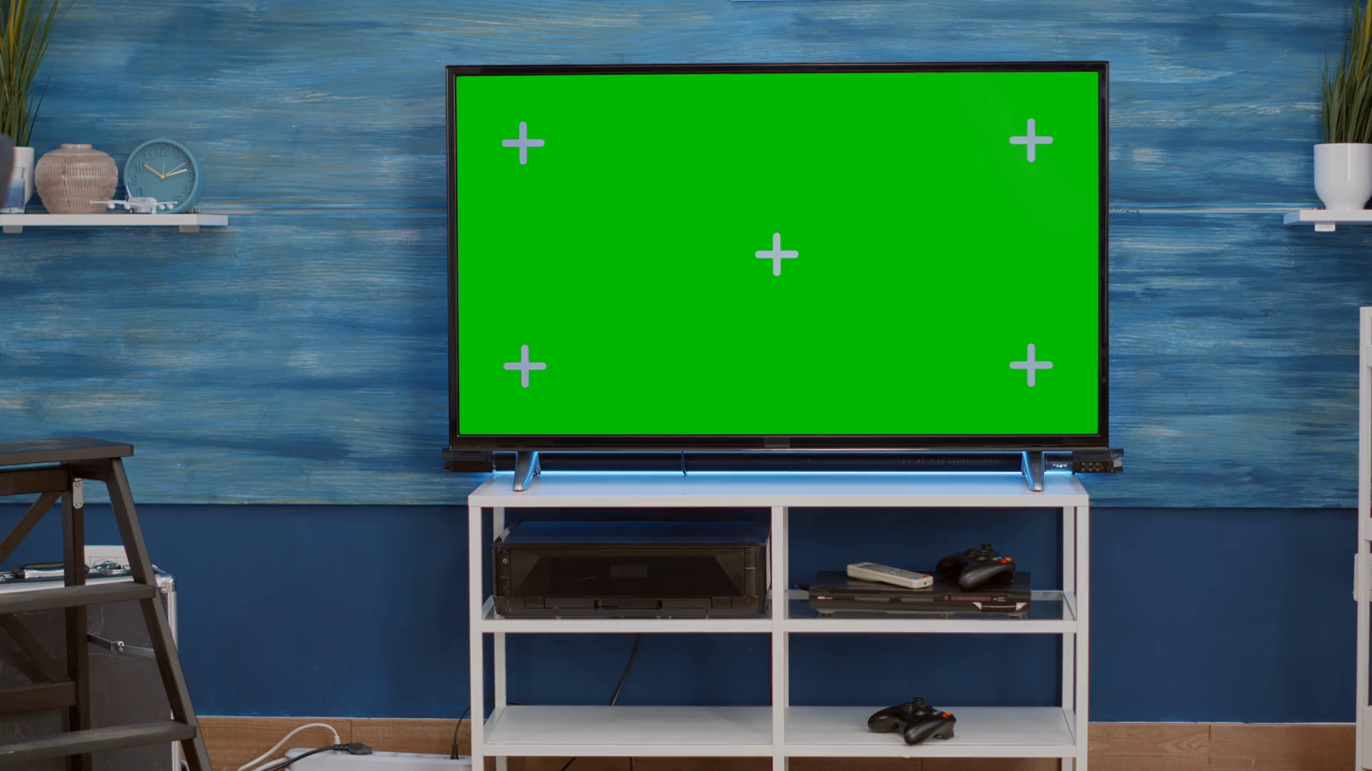 Selective focus of hand holding remote control and switching channels ...