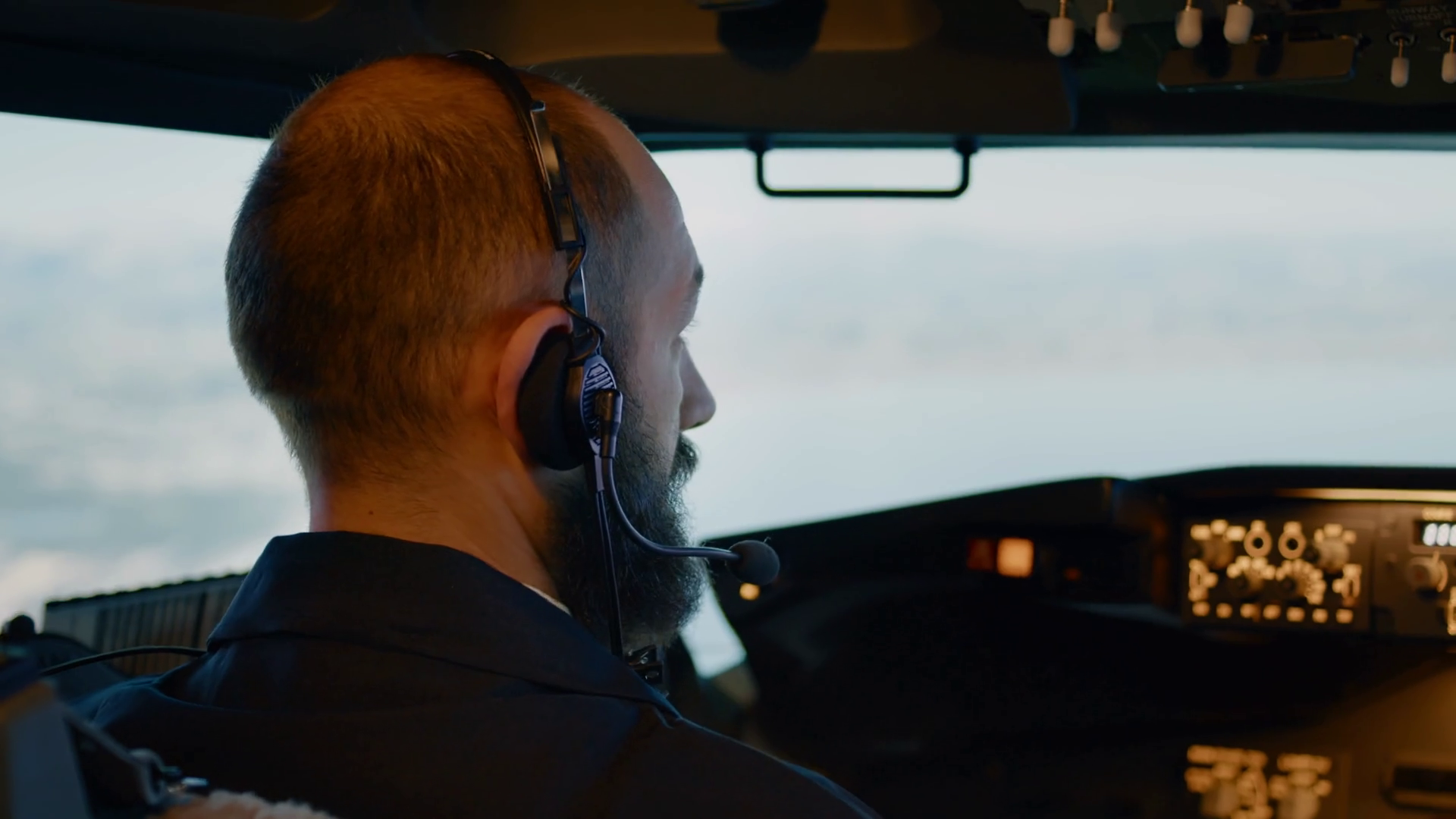 Male Captain Piloting Airplane With Engine Throttle And Power Switch On