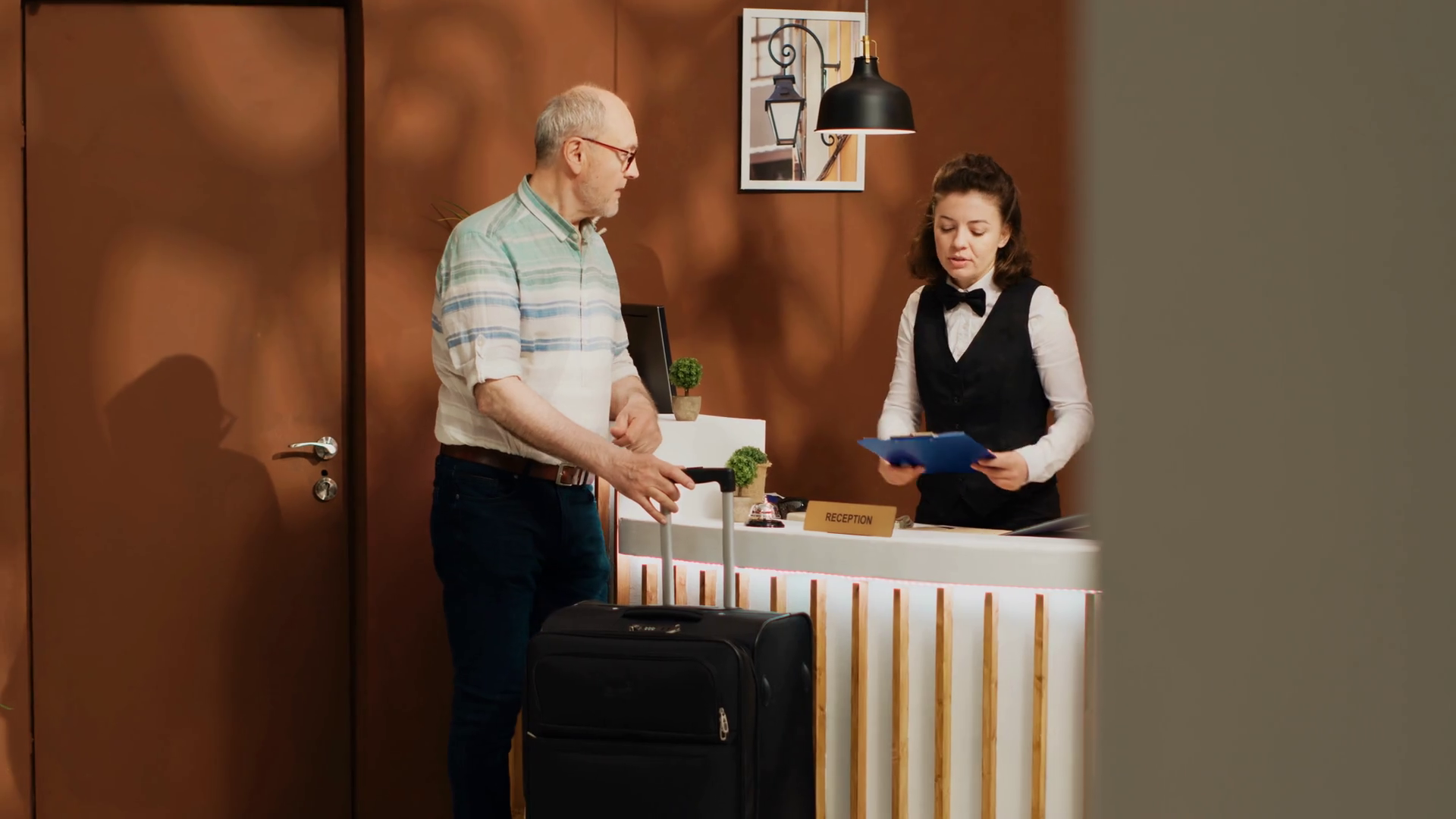 Senior Guy At Front Desk Doing Check In Stock Footage SBV-348637302 ...