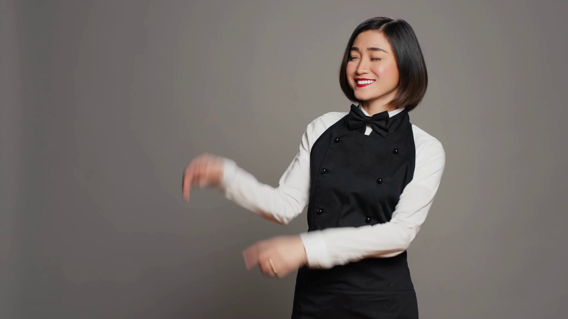 Asian Waitress Pointing Up In Studio Stock Footage SBV-348833454 ...