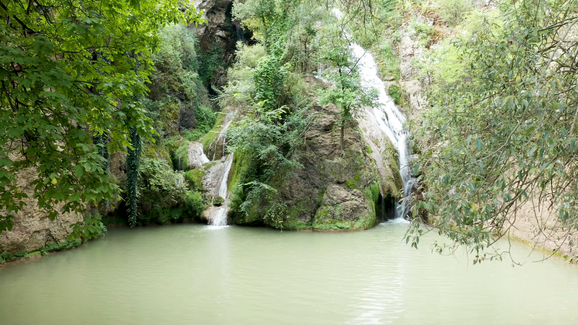 Aerial shot of beautiful waterfall in the mountains. Drone landscape ...