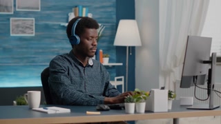 black nerd typing on computer