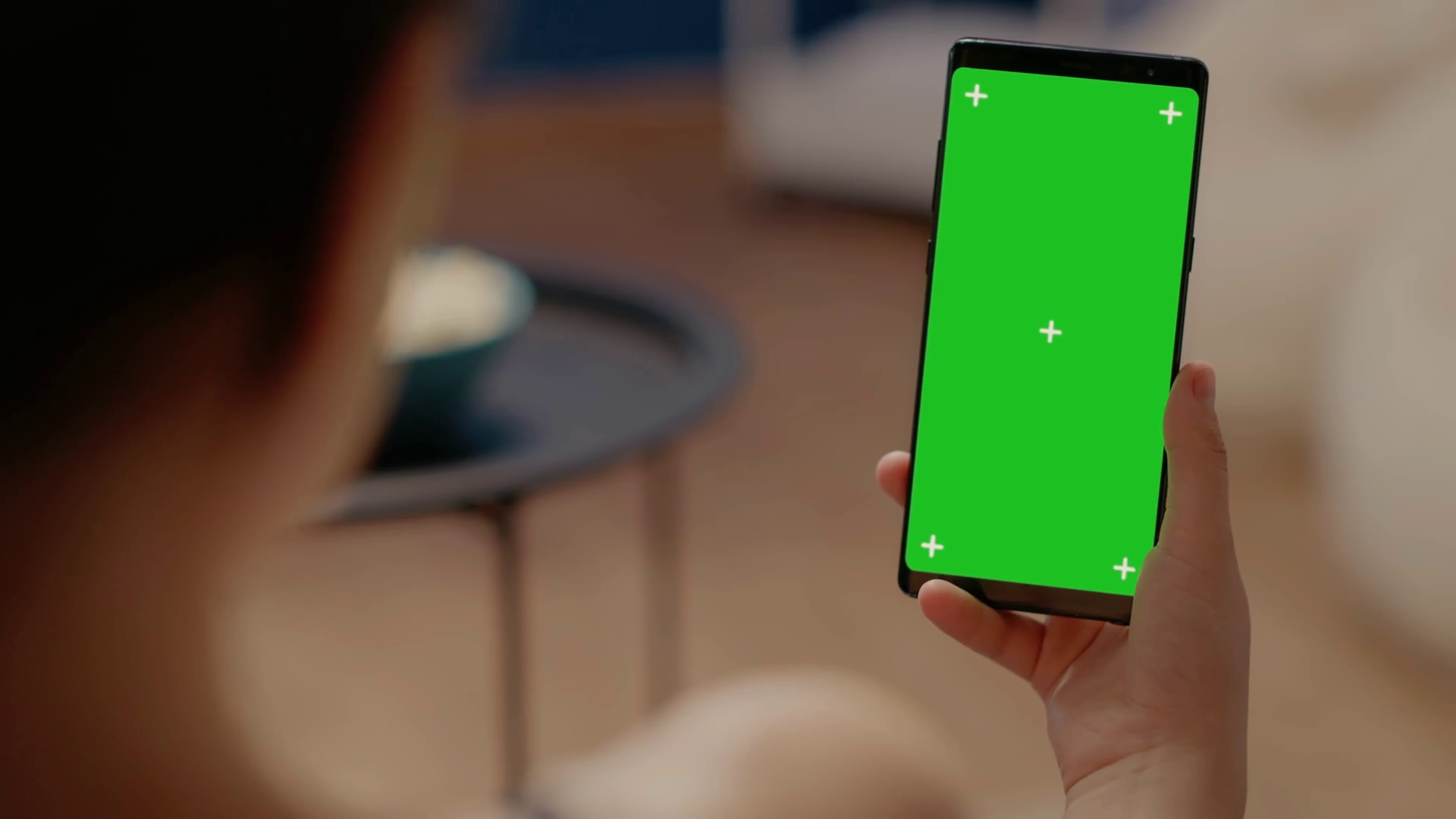 Close up on mobile phone with vertical green screen used for modern ...