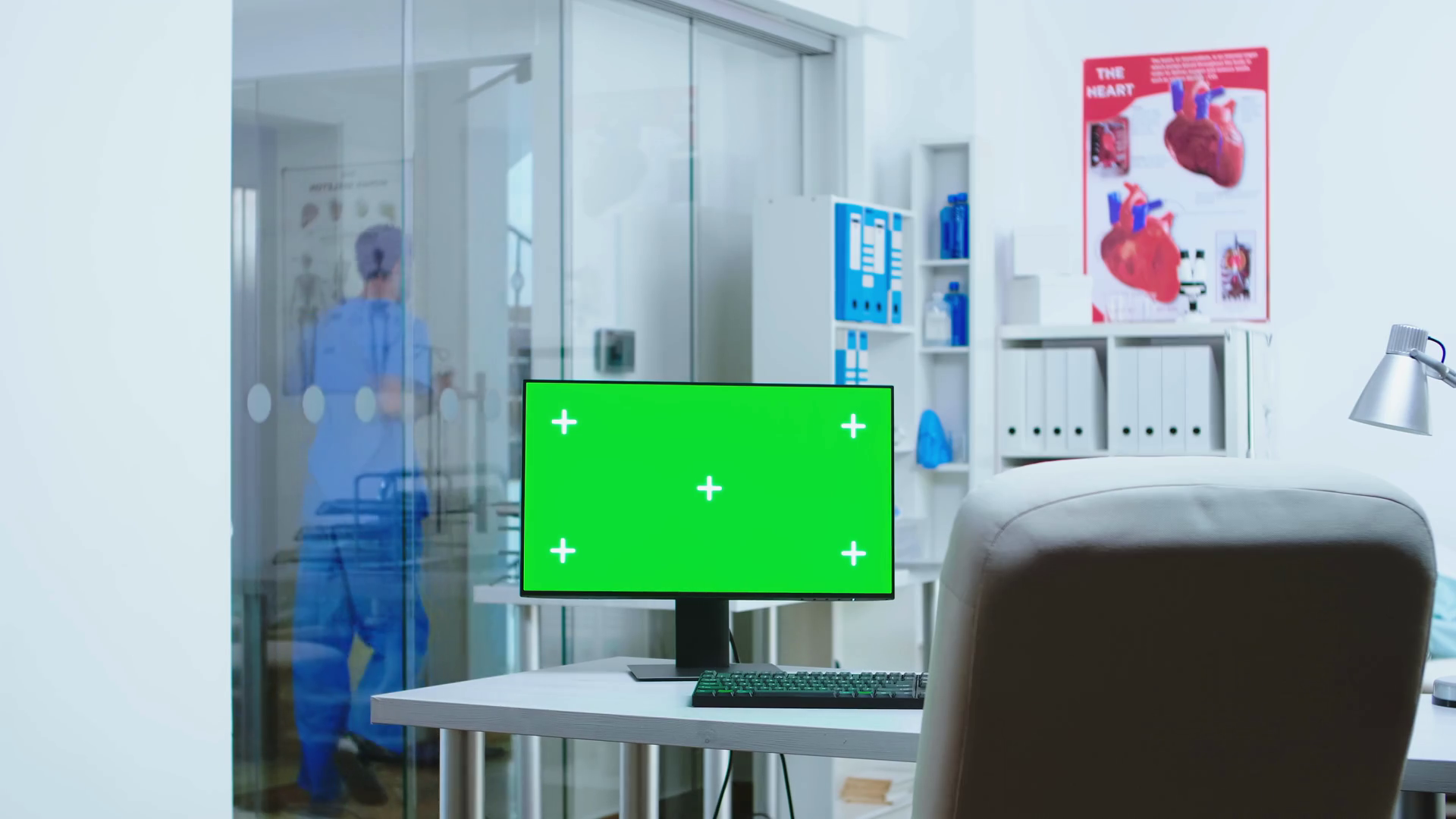 Computer with replaceable green screen in modern hospital cabinet and ...
