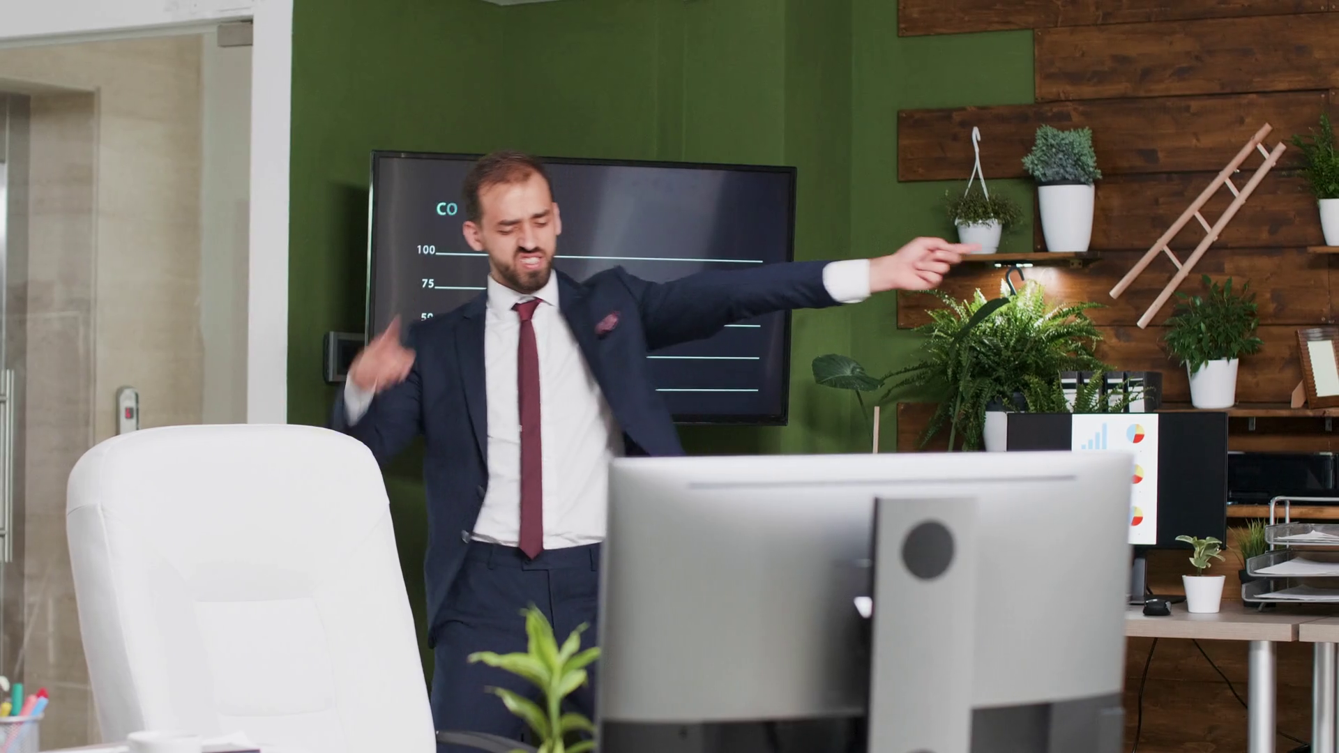 Happy and excited office worker dances in nice looking work space Stock ...