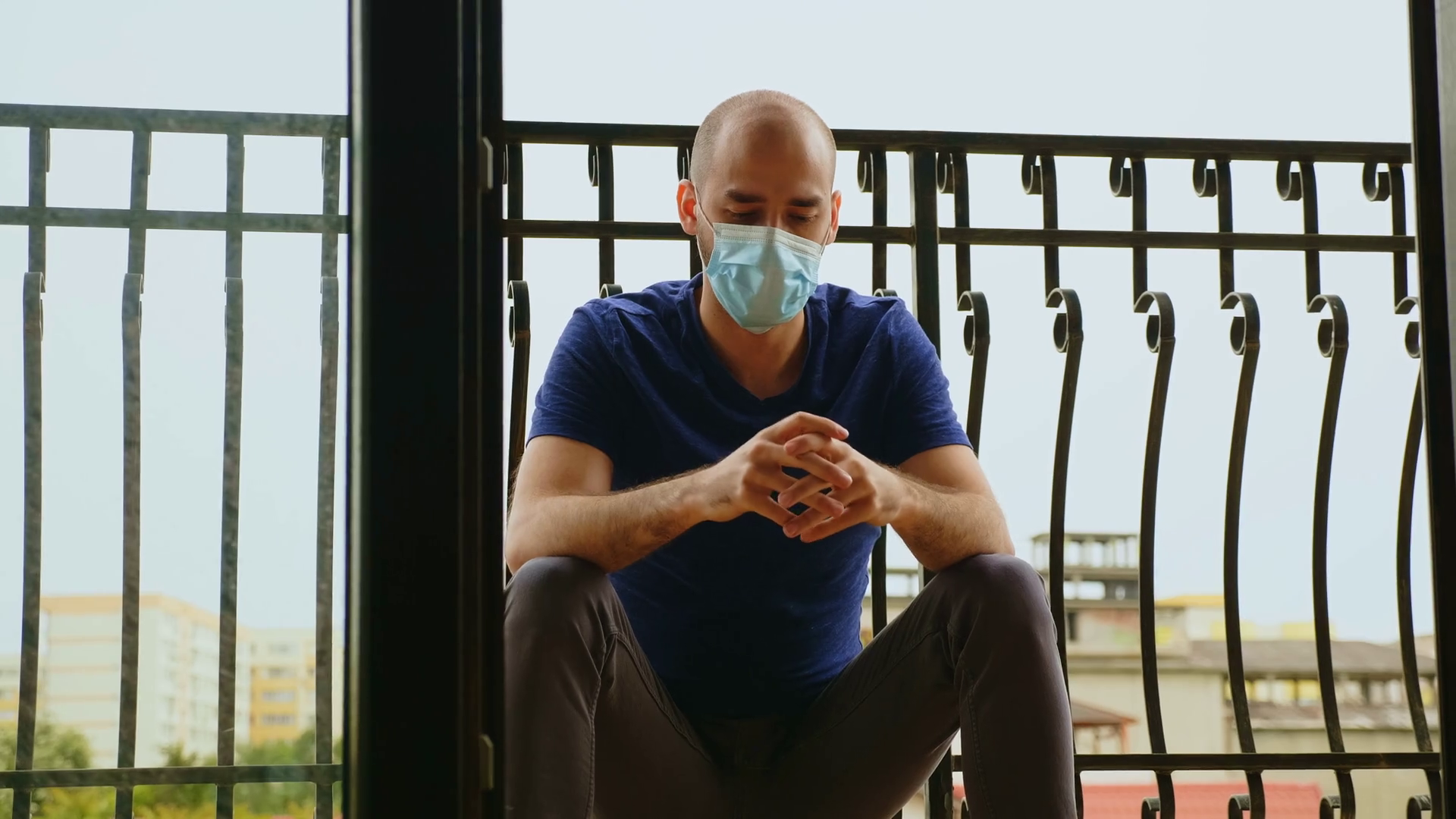 Low angle shot of depressed man during coronavirus self isolation on ...