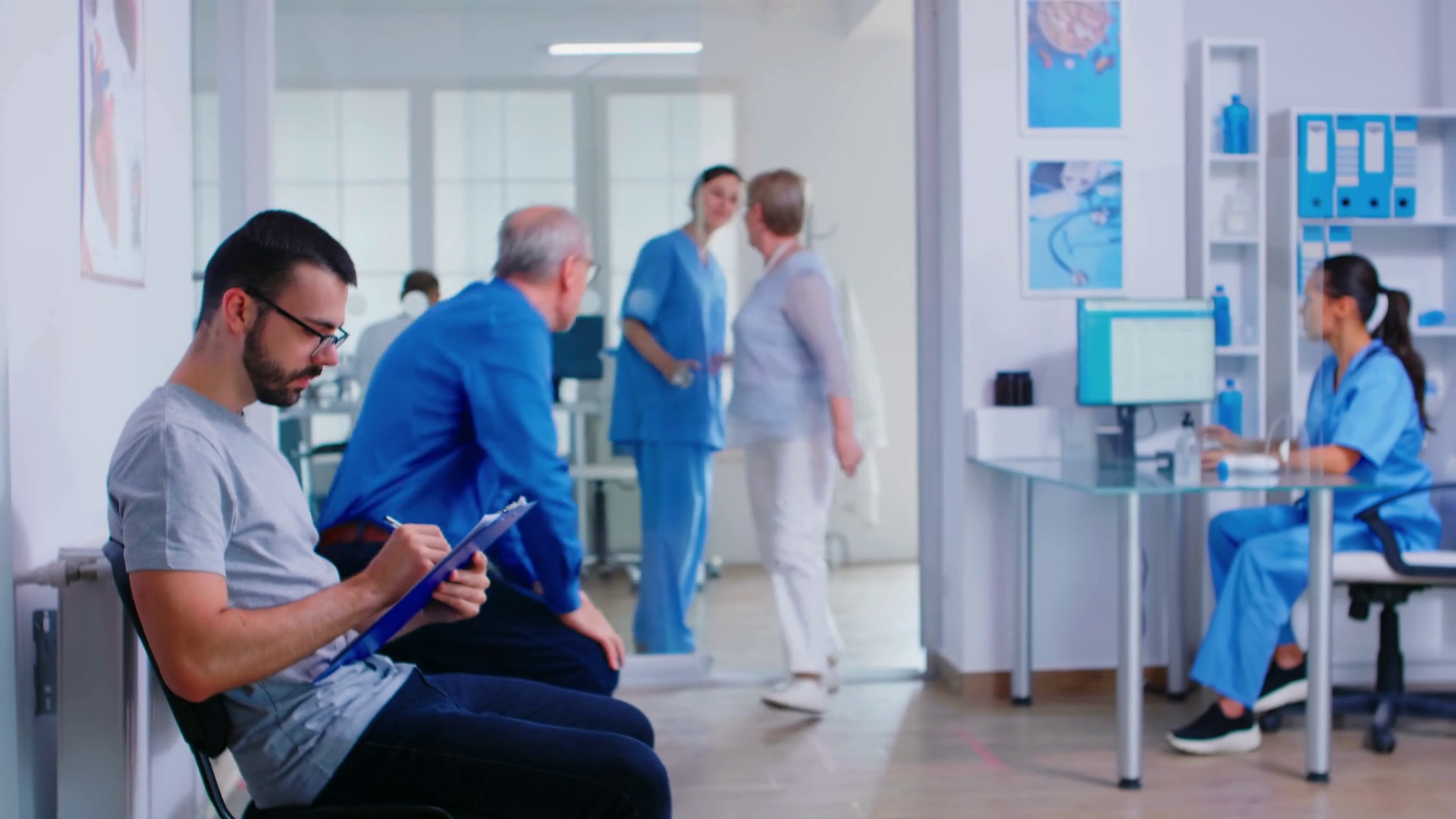 Man Filling Paperwork In Hospital Waiting Stock Footage SBV-338618735 ...