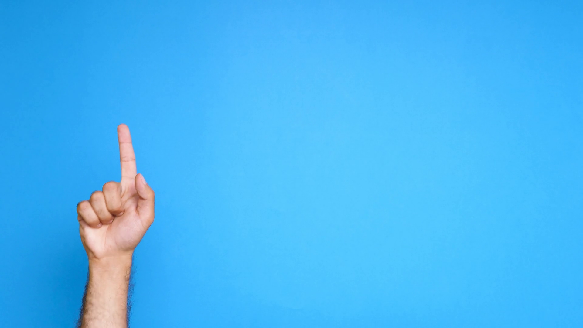 Man hand rising up on blue screen and pointing up many times. Close up ...