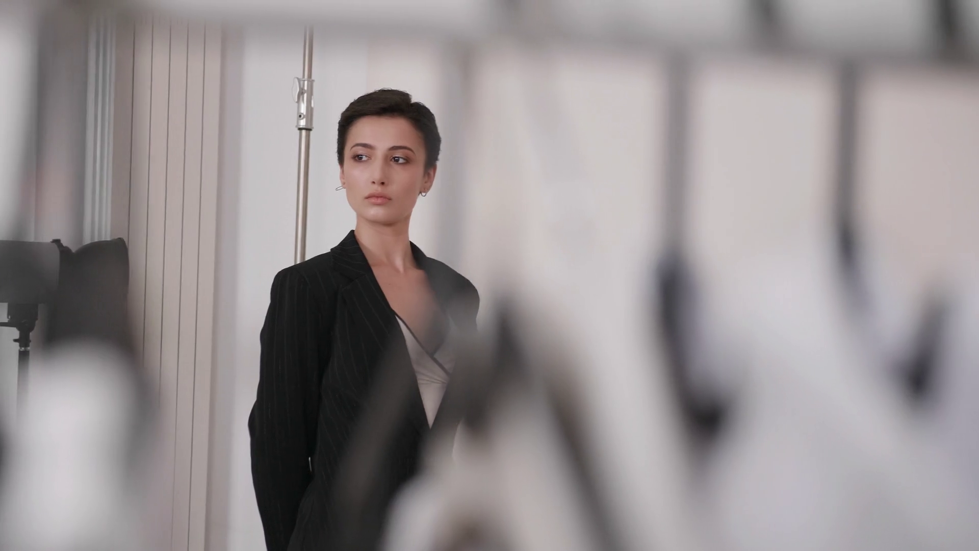 Professional model posing for a fashion photo shoot. Shot handheld ...