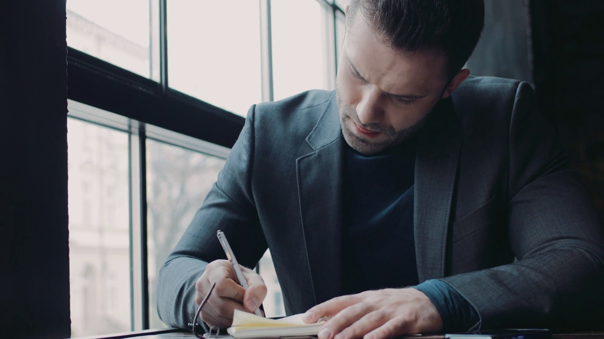 A Young Man Taking Notes In Café Window Stock Footage SBV-314294250 ...