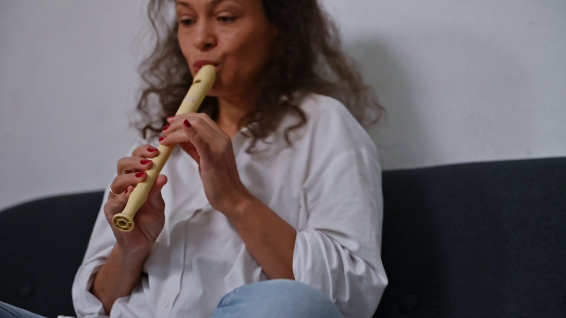 Woman Playing Recorder Sitting On Sofa At Stock Footage SBV-349336603 ...