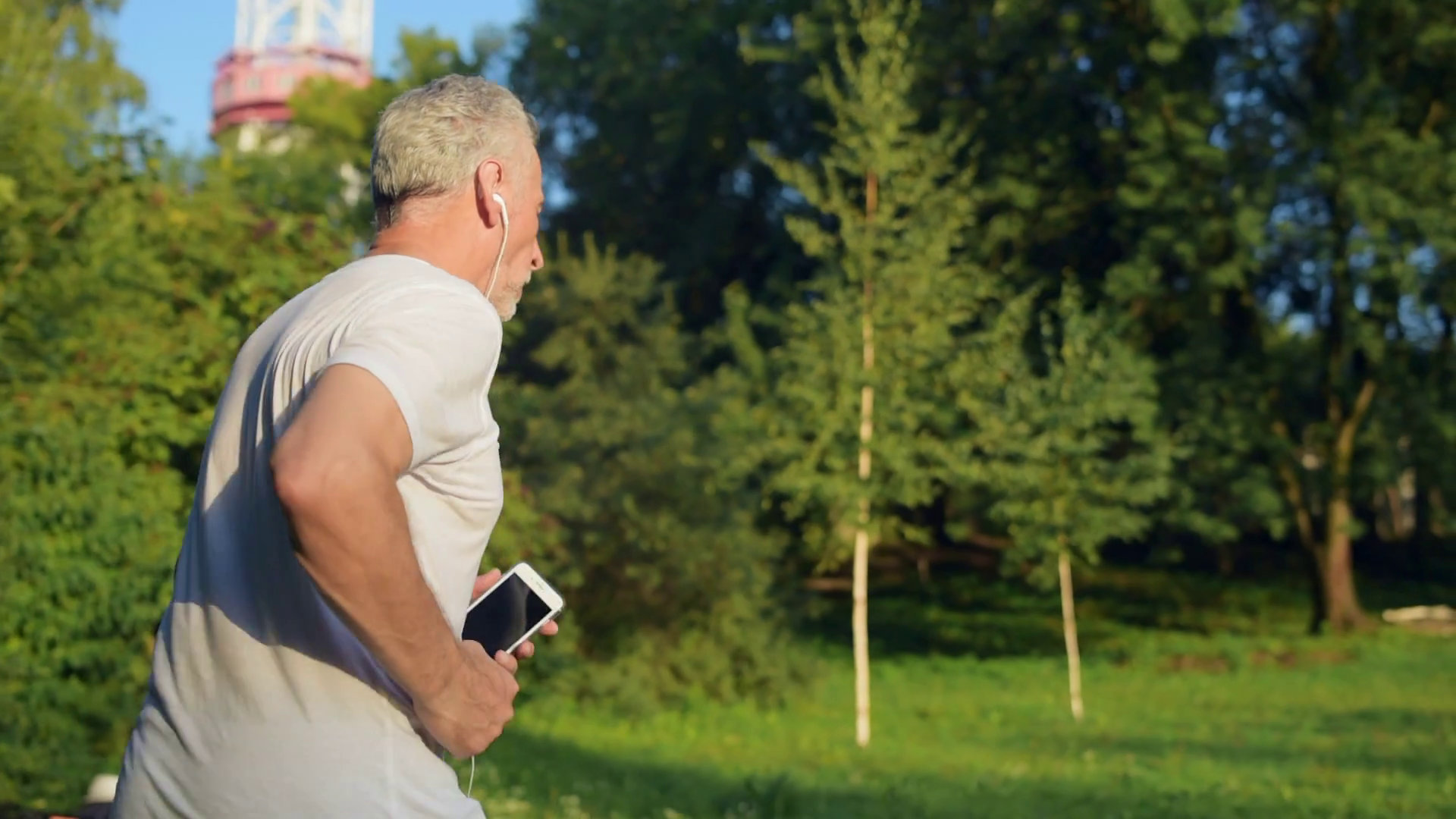 Tracking Shot Of Pleasant Aged Man Jogging Stock Footage SBV-317619231 ...