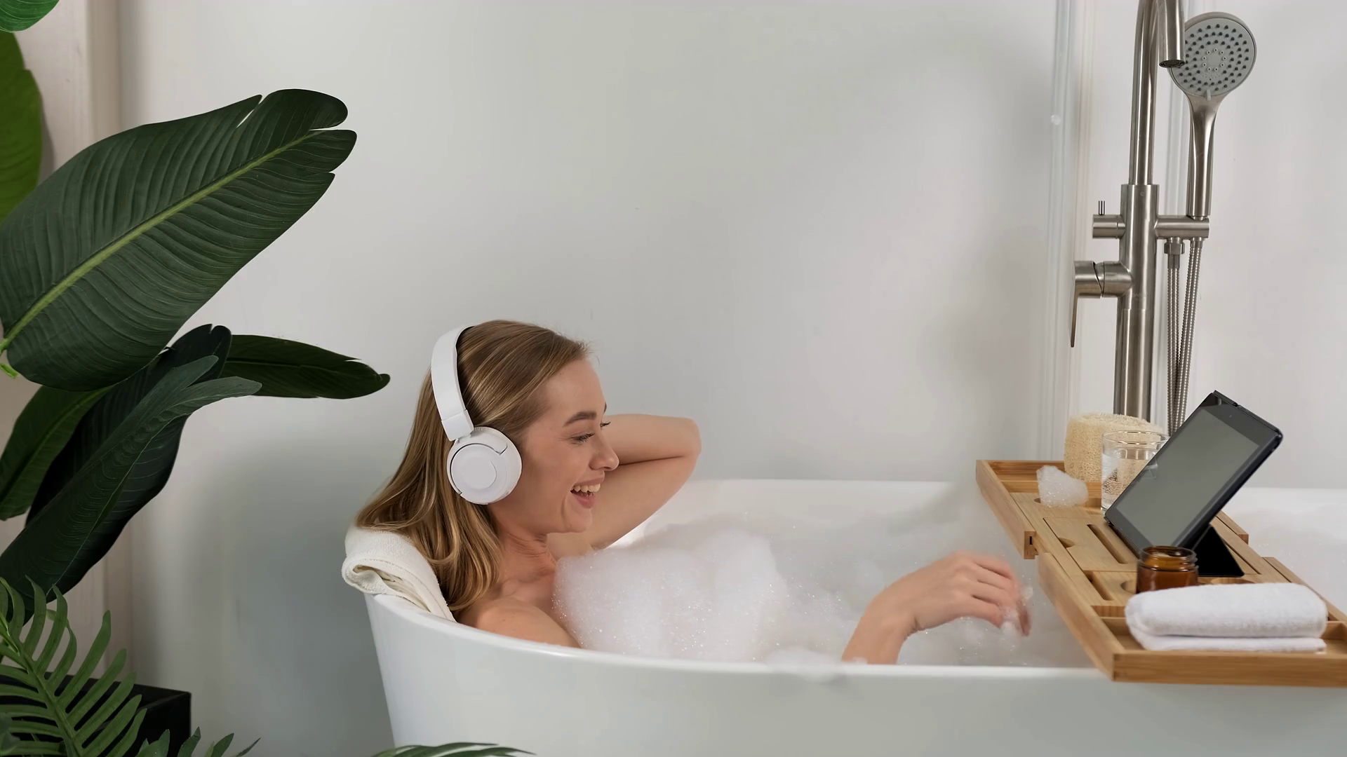 A Woman Wearing Headphones Listens To Music Stock Footage SBV-348597989 ...