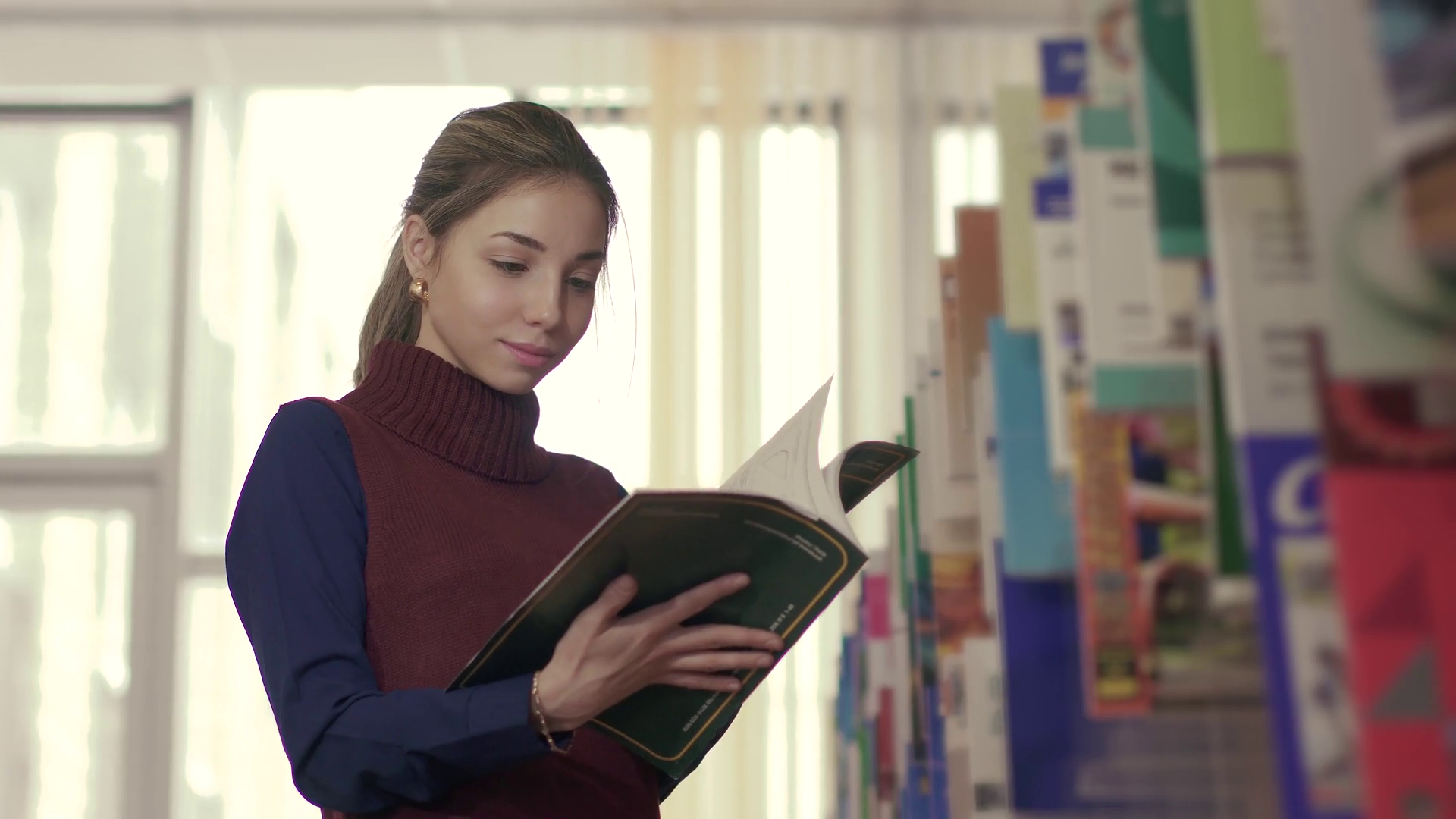 Young Woman In Library Reading Chosen Book Stock Footage SBV-313275156 ...