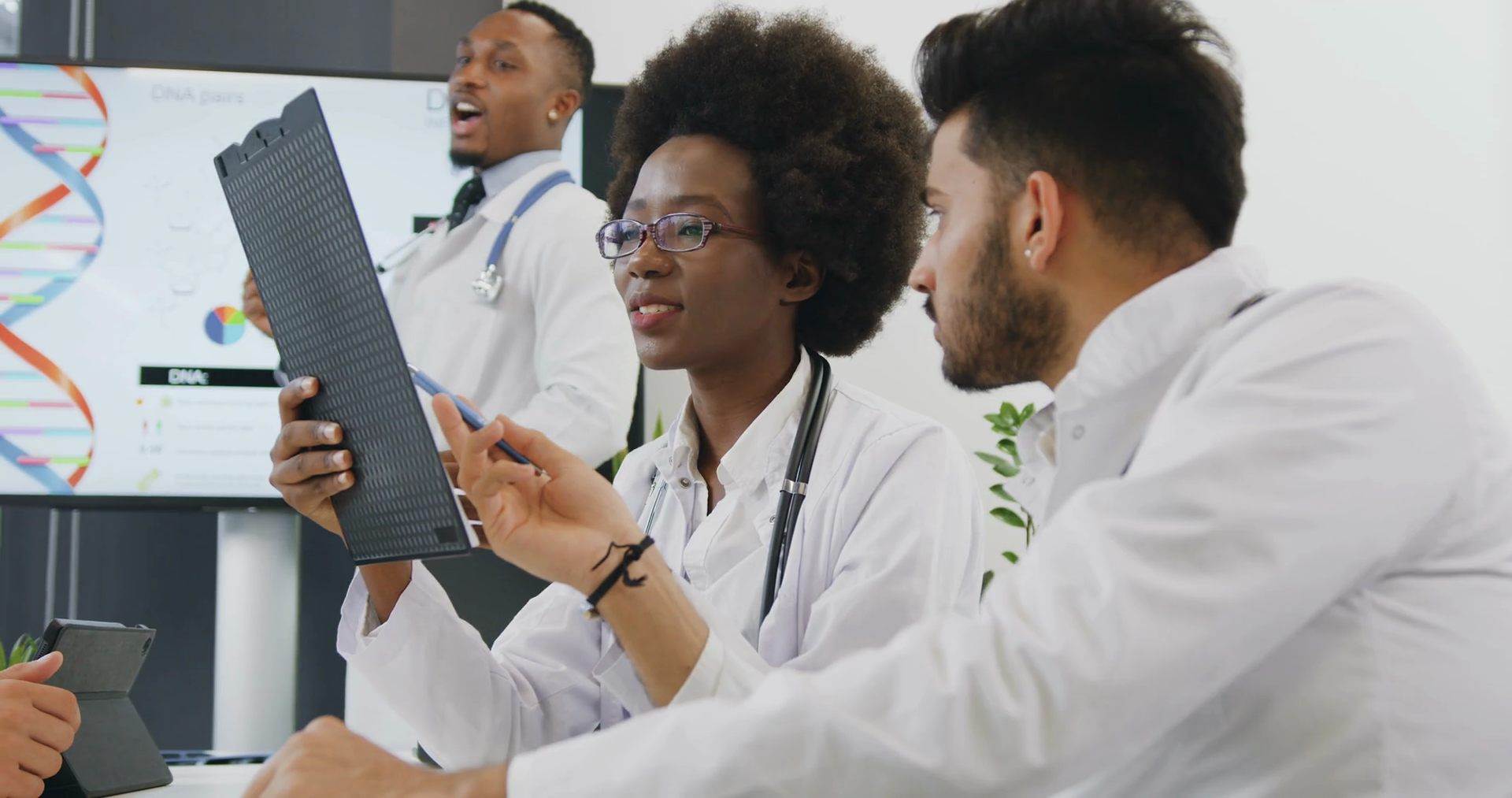 Likable positive successful mixed race medical coworkers advising ...