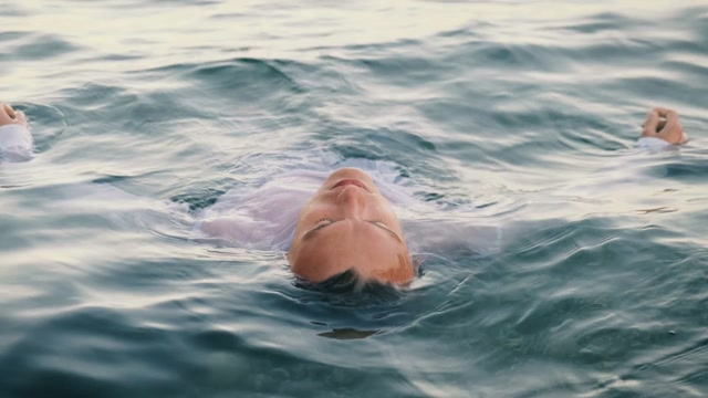Man Floating In Water Stock Footage: Royalty-Free Video Clips - Storyblocks