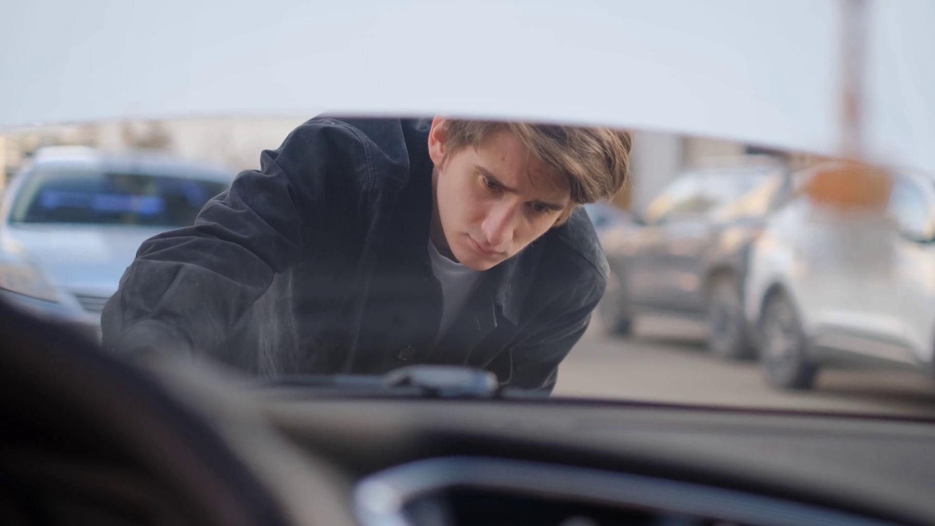 A Confused Young Driver Looks Under Hood Of Stock Footage SBV-351901437 ...