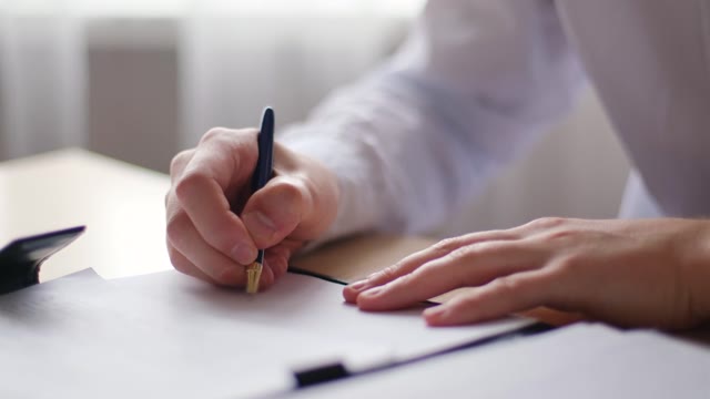 Signing Paper Stock Footage: Royalty-Free Video Clips - Storyblocks