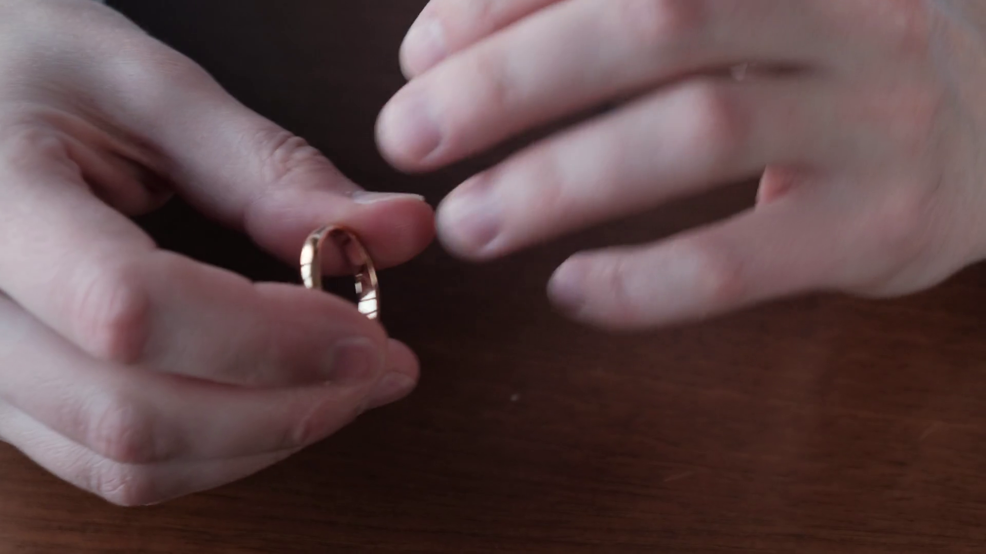 Fading feeling of love. Man takes off his wedding ring from his finger ...