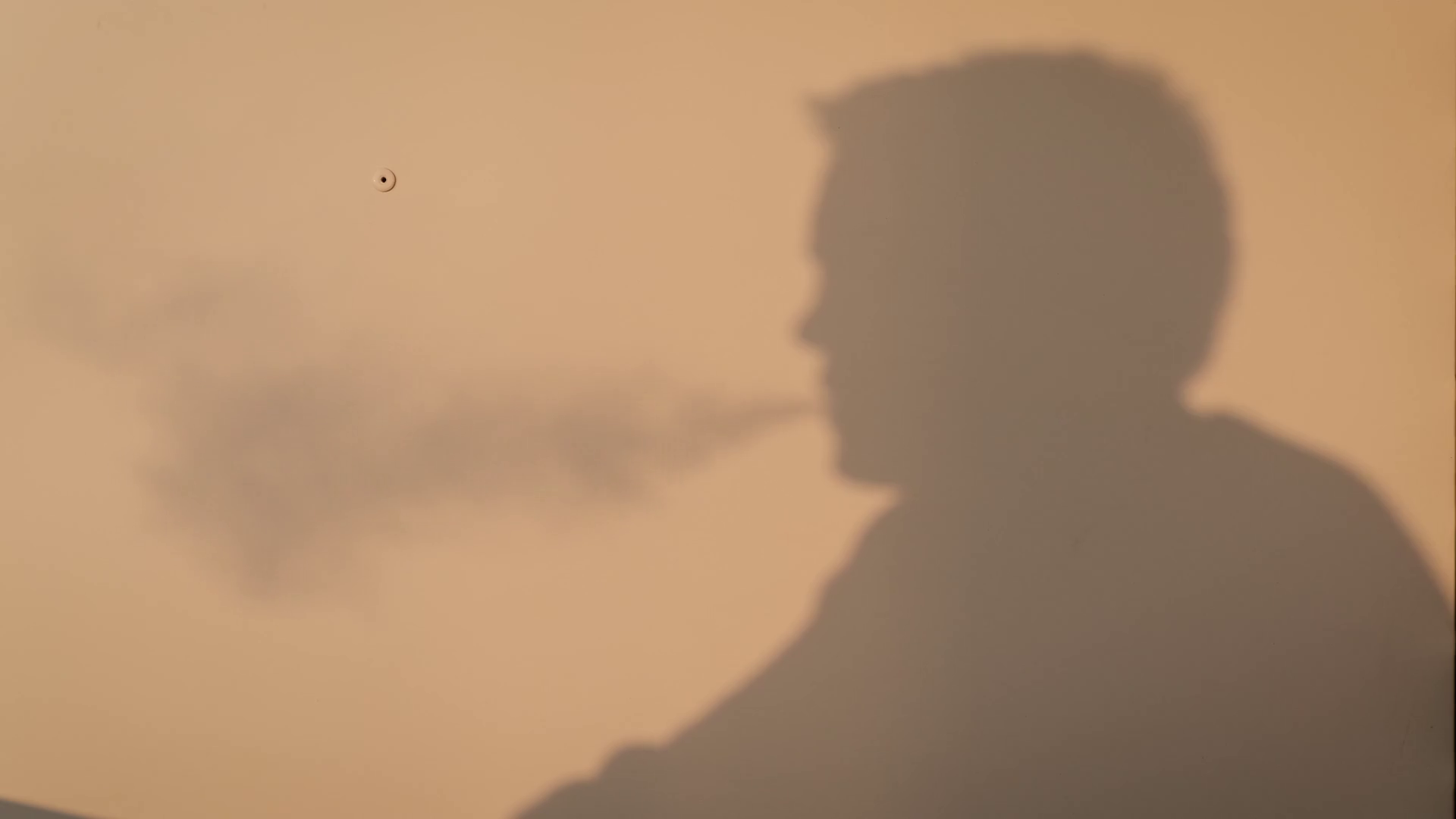 Silhouette Shadow Of Smoking Man On Wall Stock Footage SBV-347265344 ...